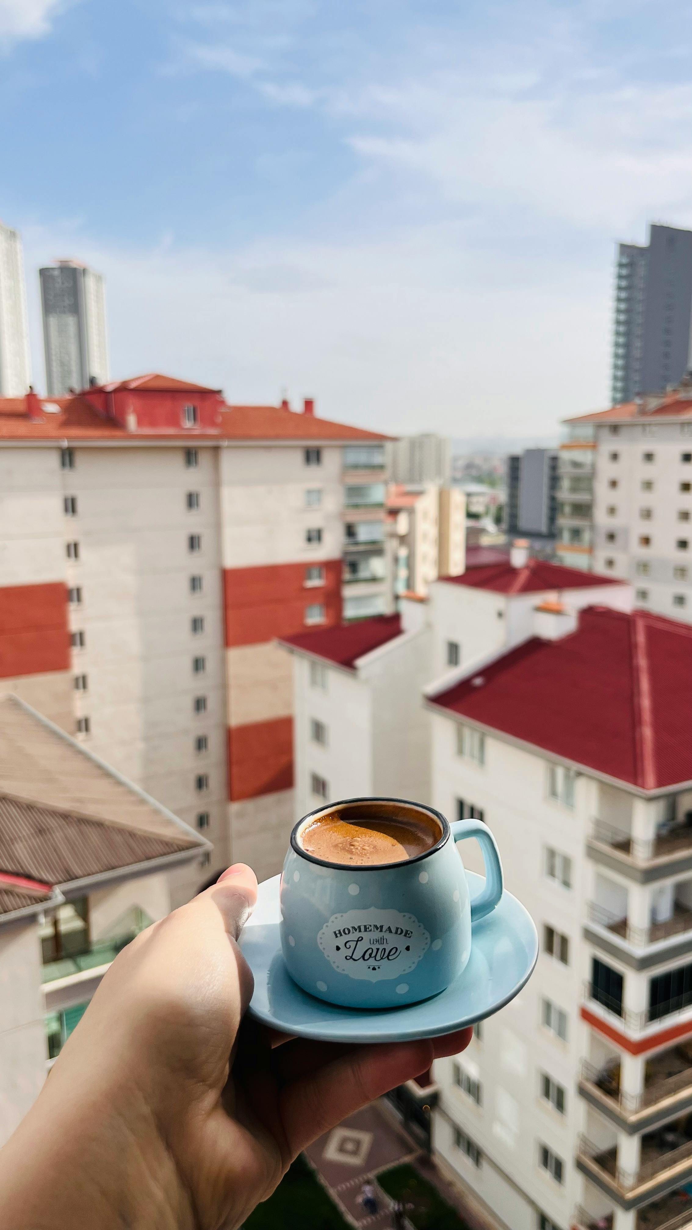 Cozy Morning Coffee with Cityscape View · Free Stock Photo