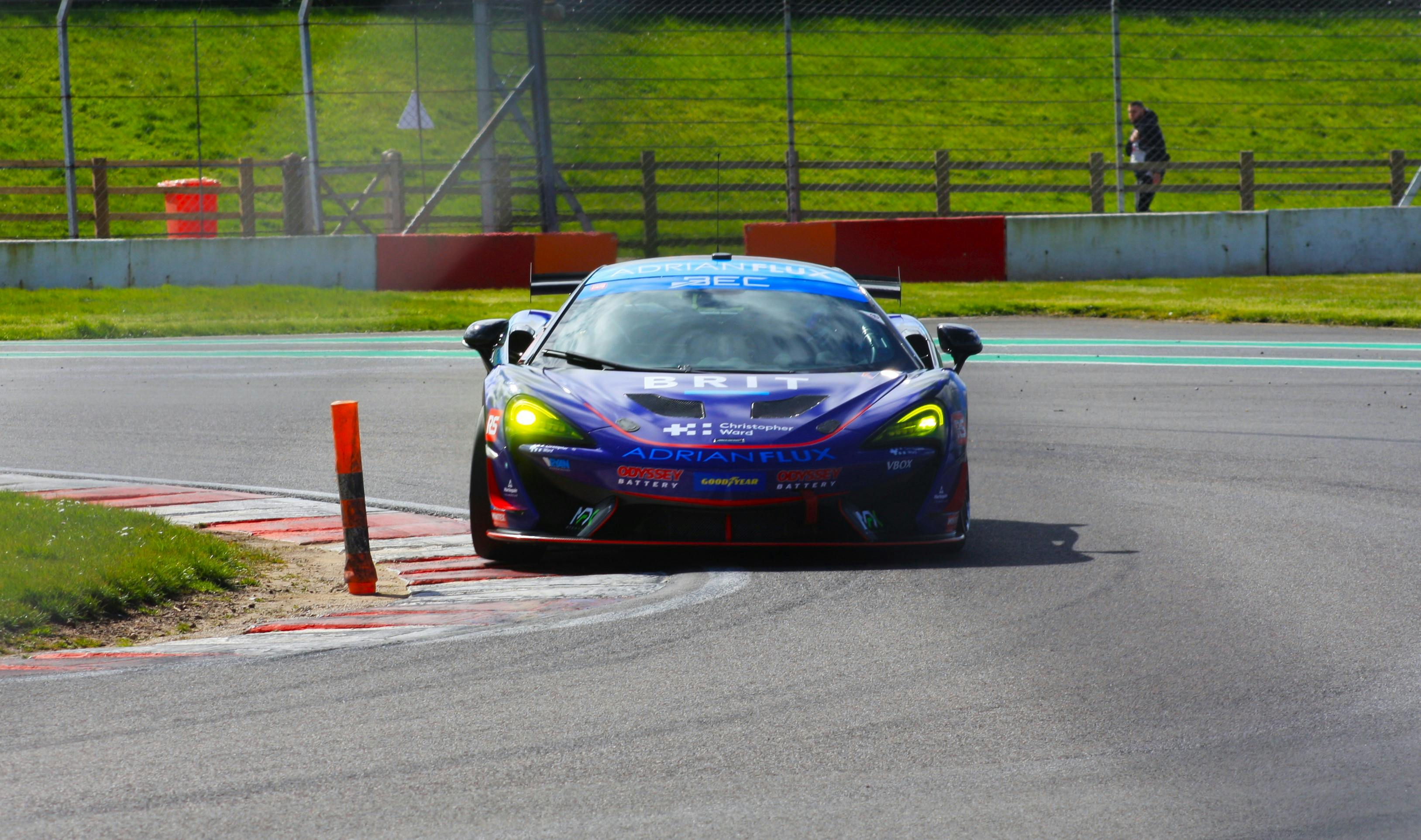 High-Speed McLaren on Castle Donington Racetrack · Free Stock Photo