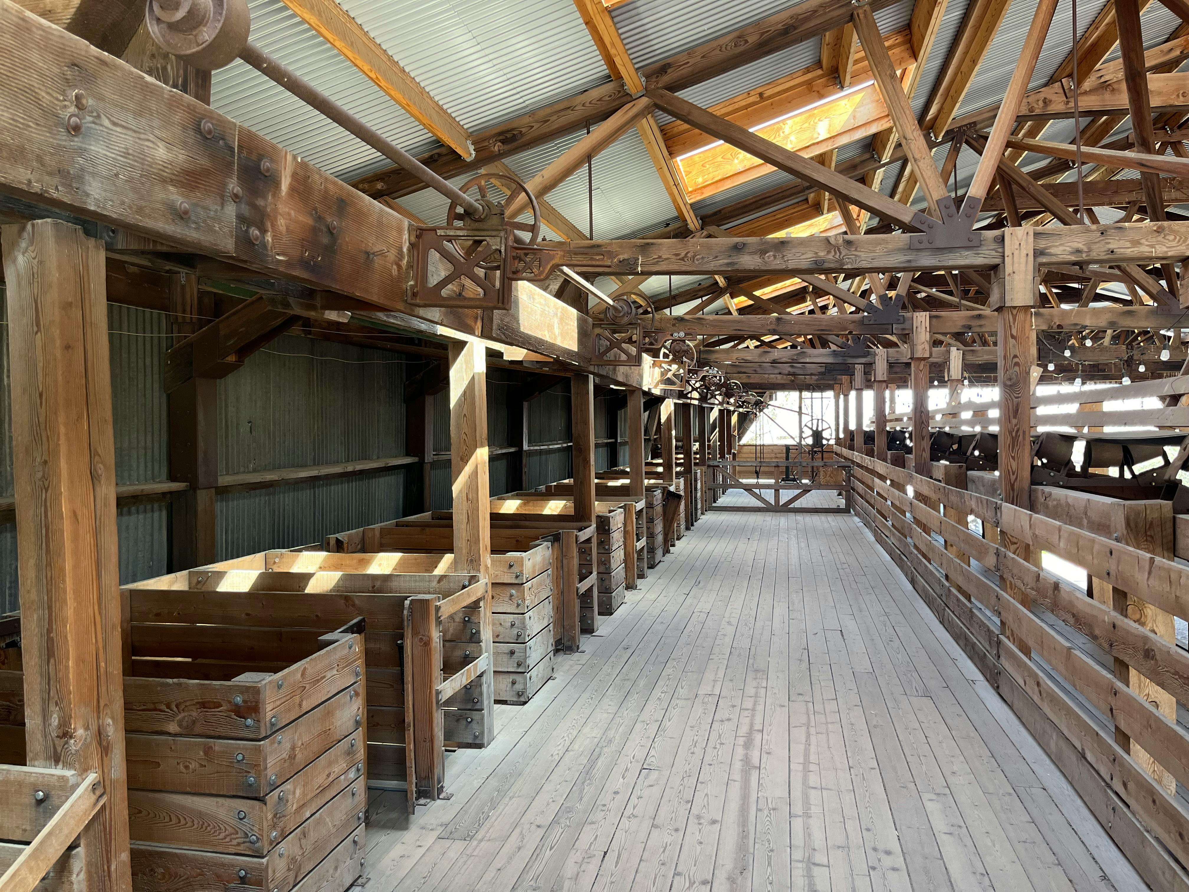 Rustic Interior of Wooden Barn with Beams · Free Stock Photo