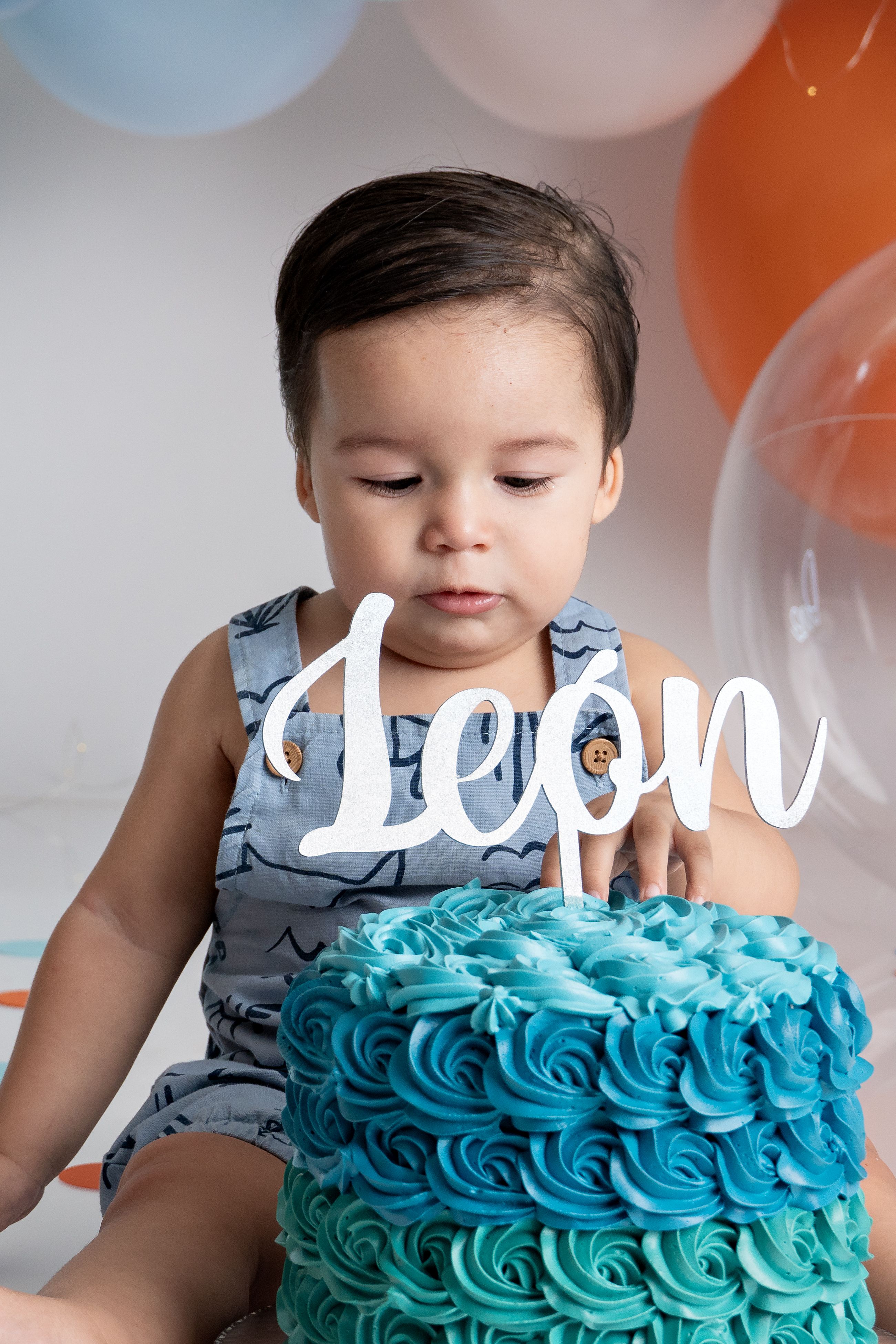 Baby Celebrating Birthday with Blue Cake · Free Stock Photo