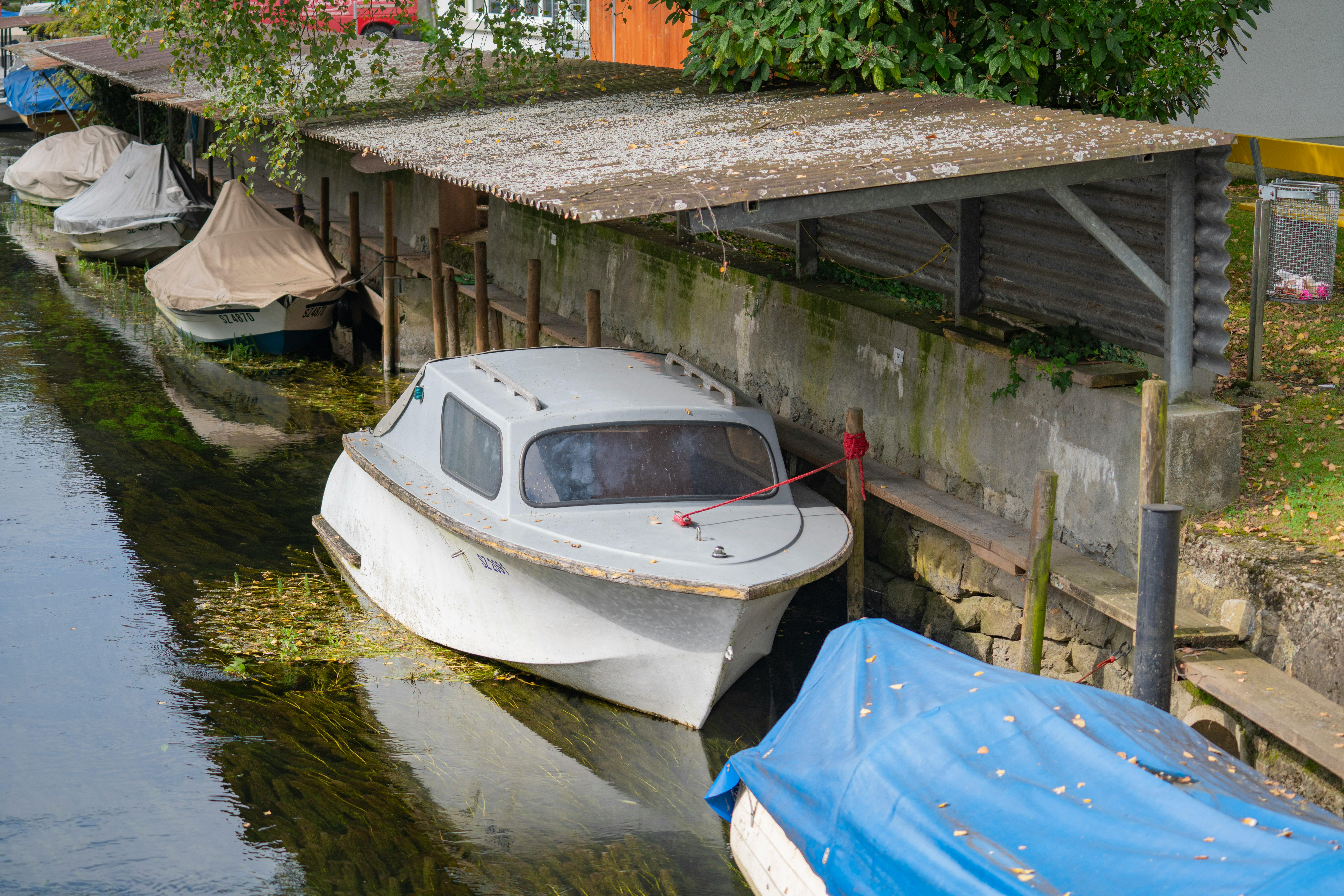 Mooring of Covered Boats Along Canal · Free Stock Photo