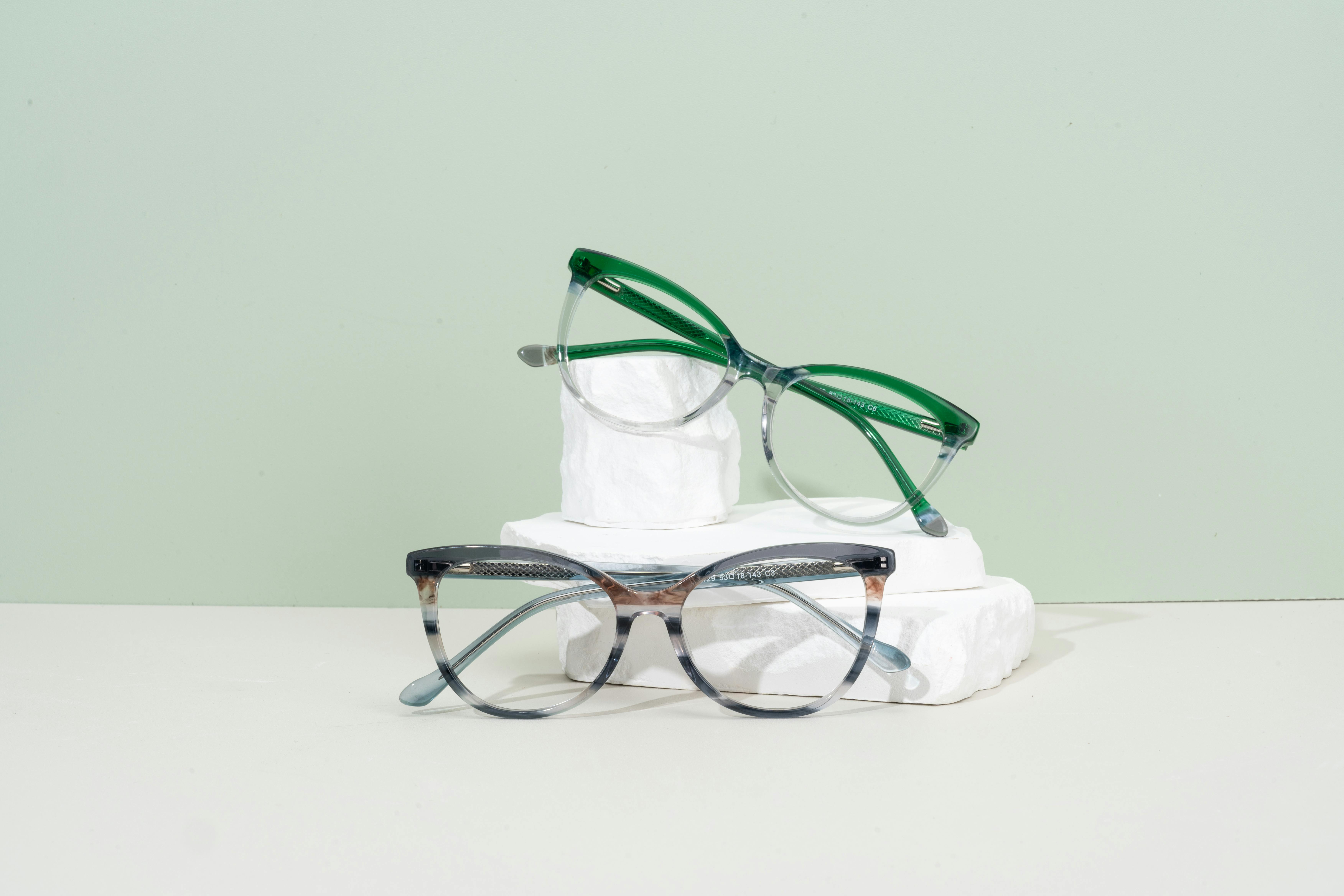 Stylish Eyeglasses Display on Minimalist Background · Free Stock Photo