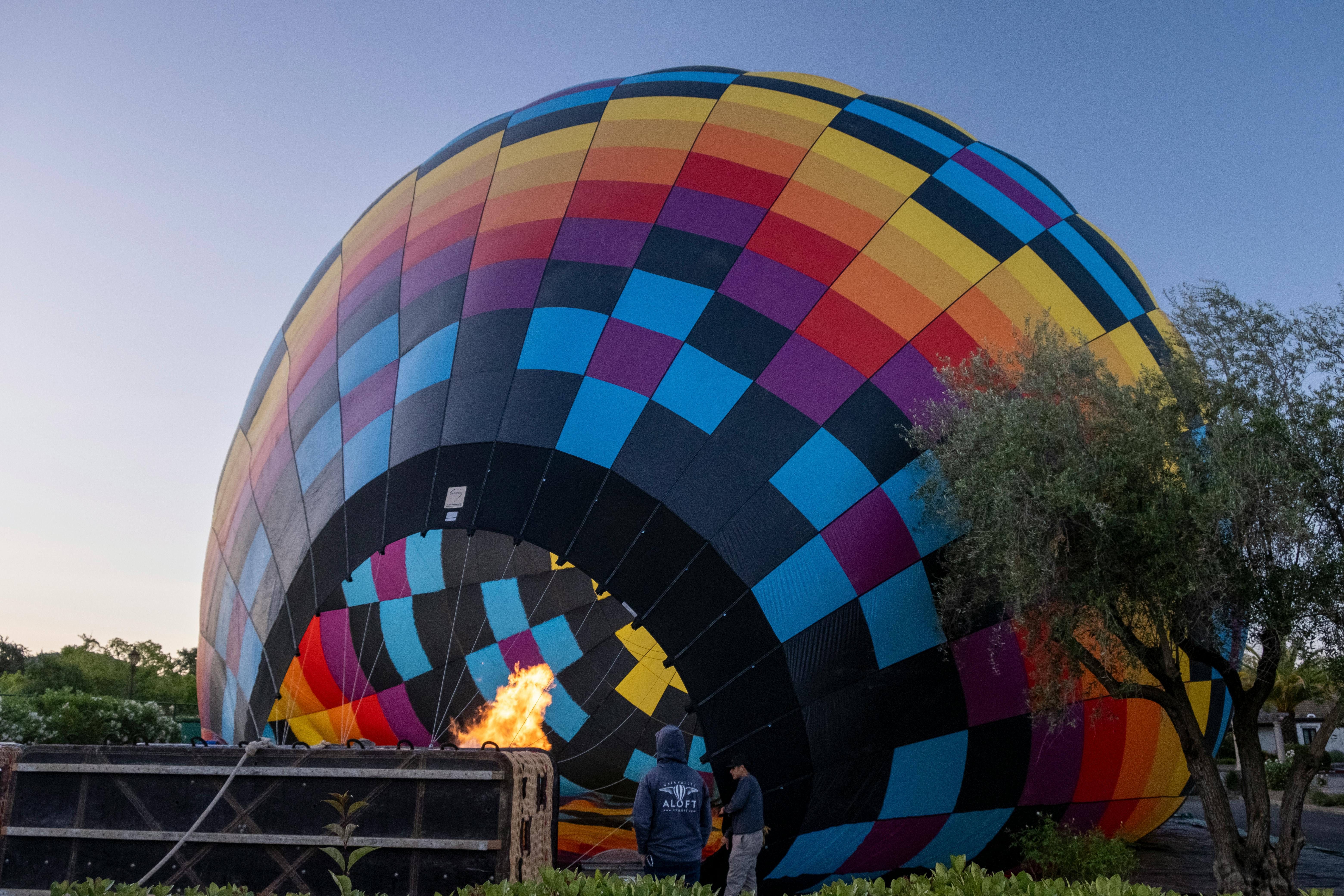 Colorful Hot Air Balloon Being Inflated at Dawn · Free Stock Photo