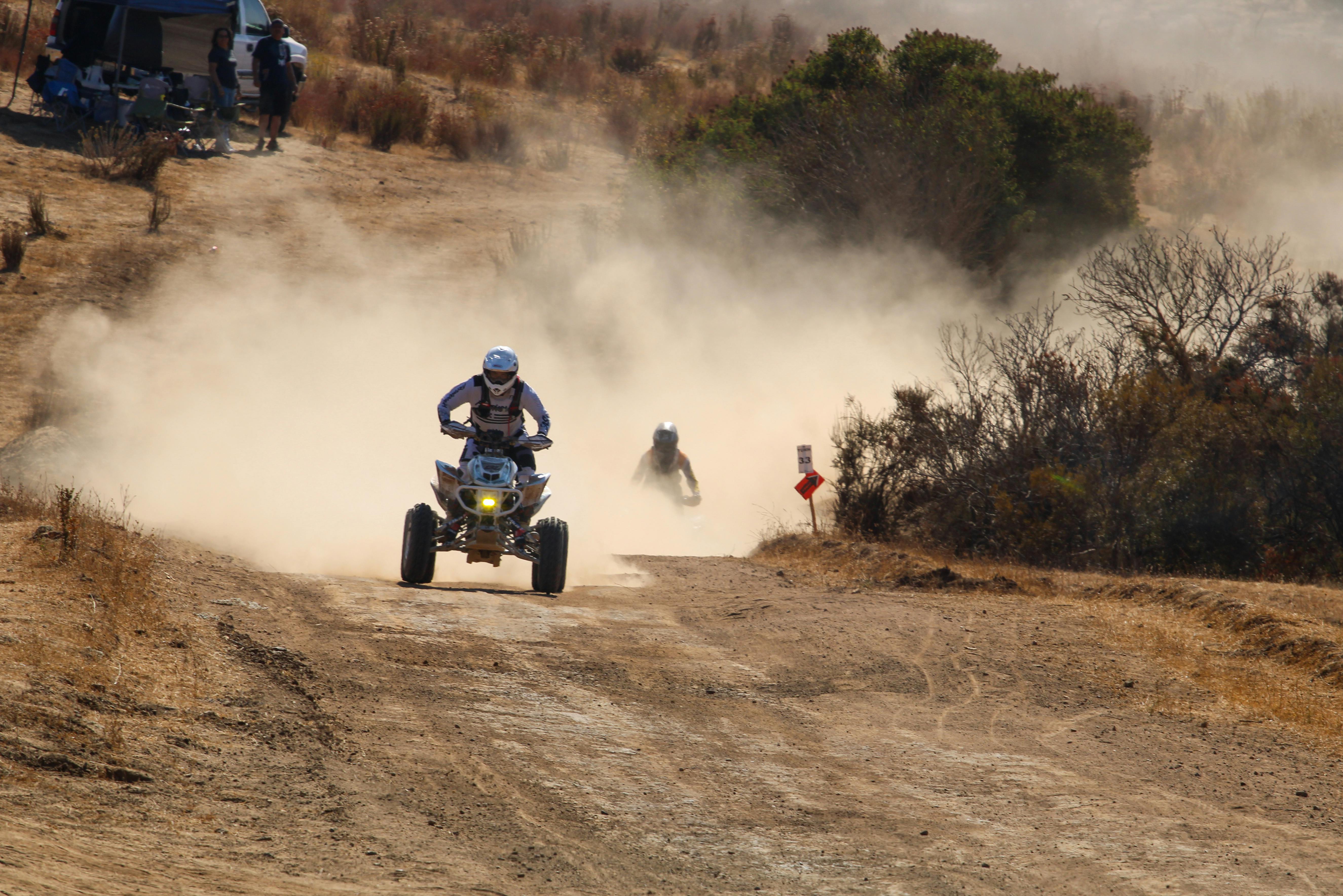 Off-Road Adventure: ATVs Kicking Up Dust · Free Stock Photo