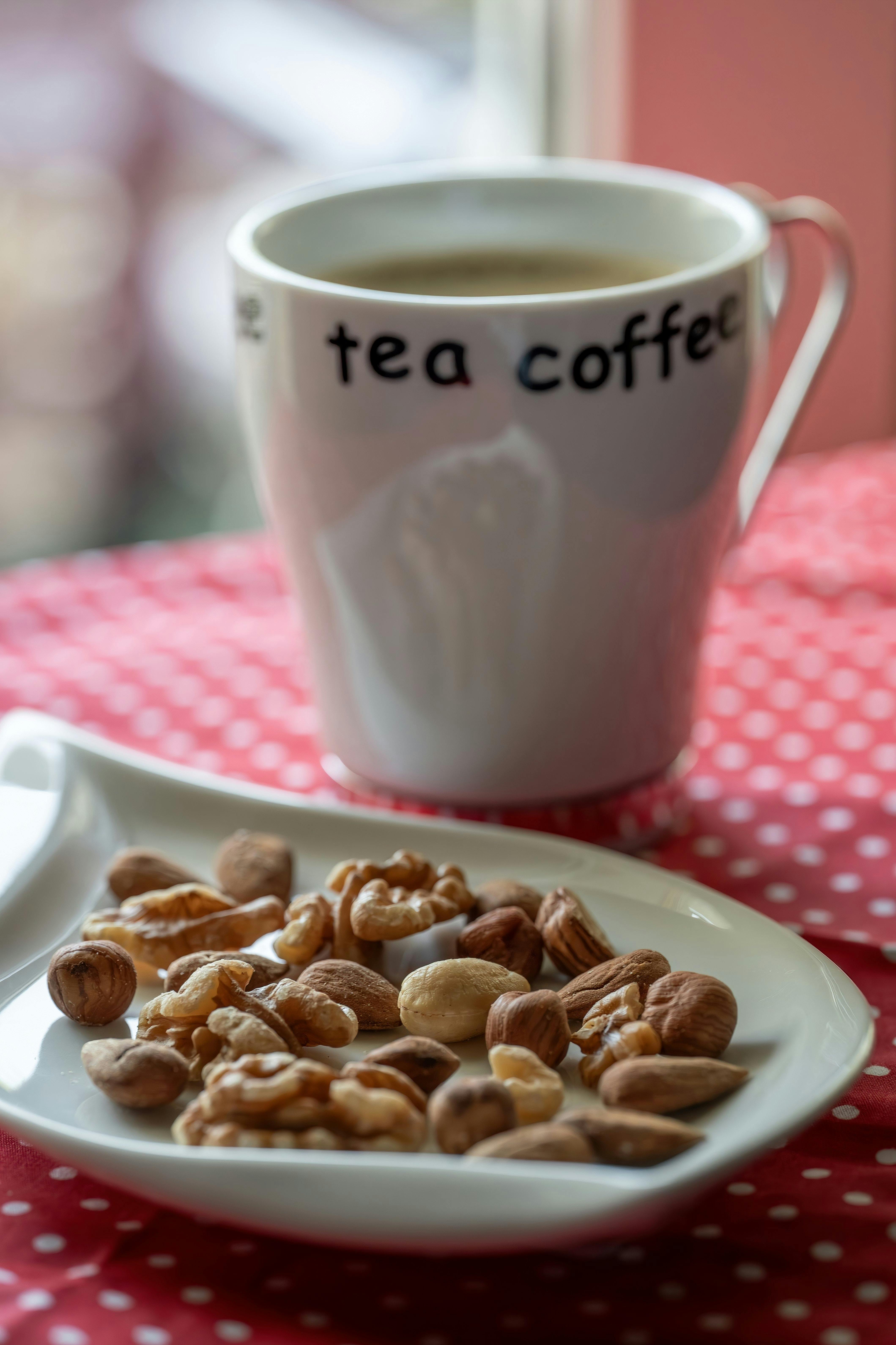 Cozy Morning with Coffee and Nuts · Free Stock Photo