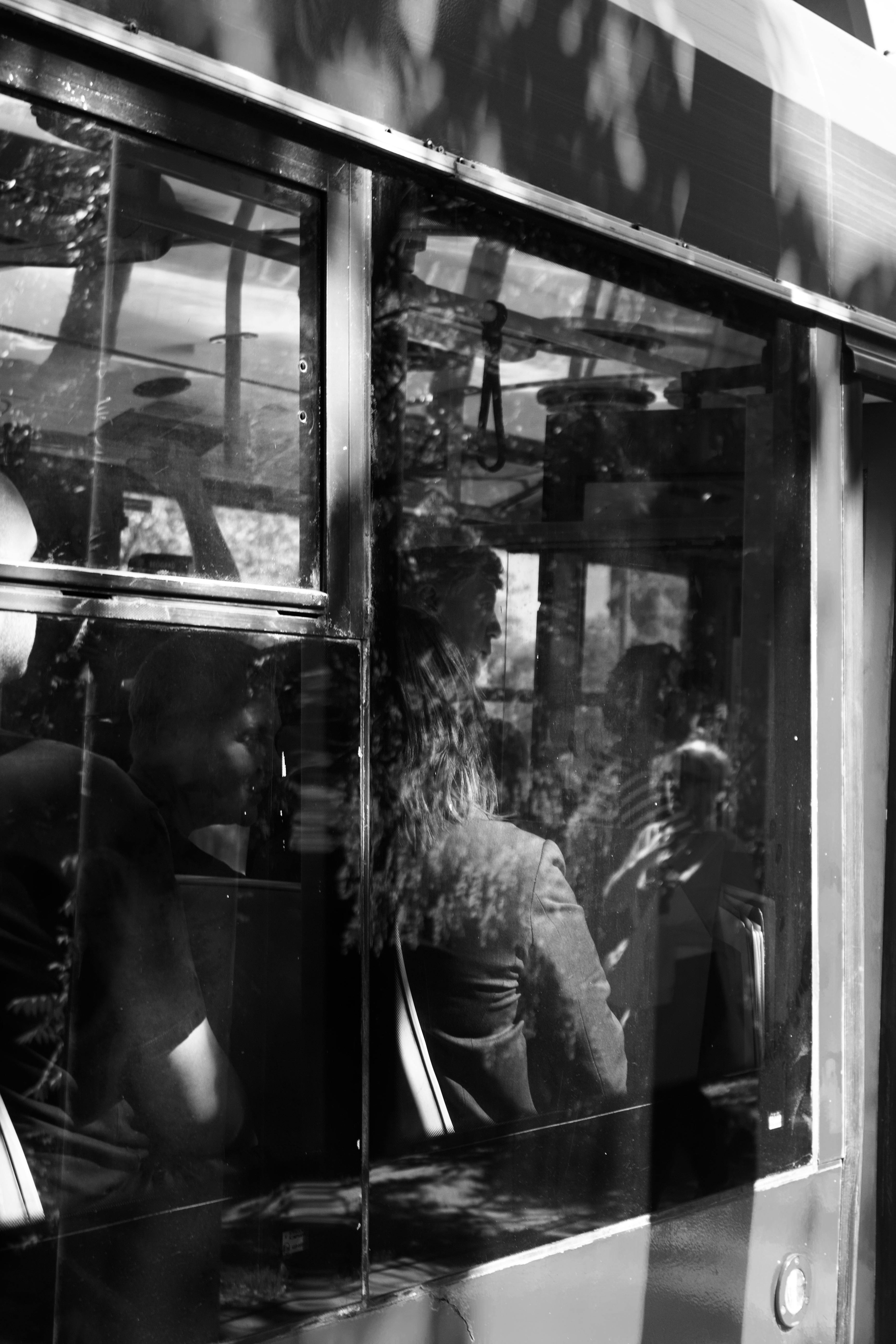 Black and White Reflection on City Bus Window · Free Stock Photo