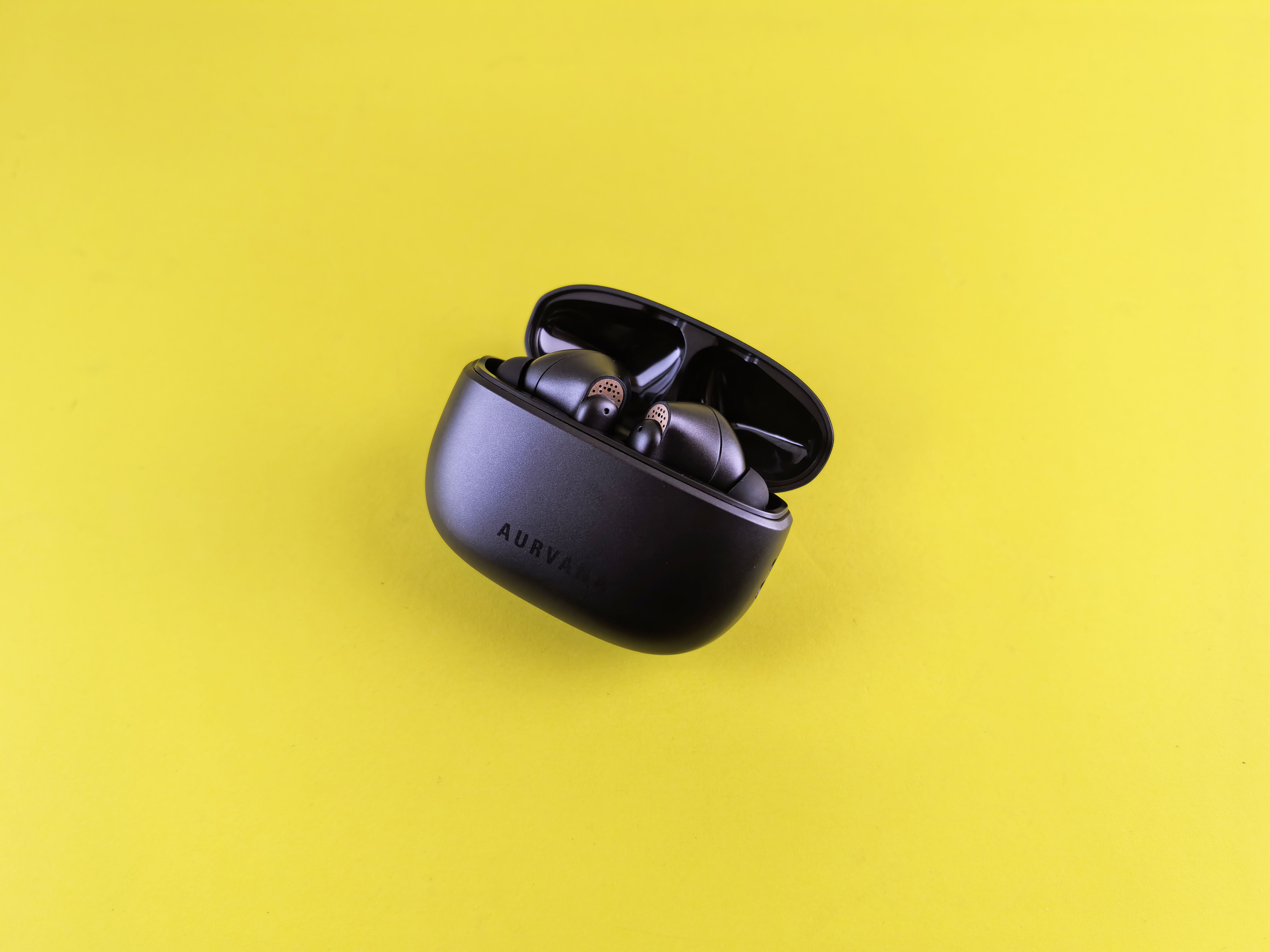 Stylish Wireless Earbuds on Yellow Background · Free Stock Photo