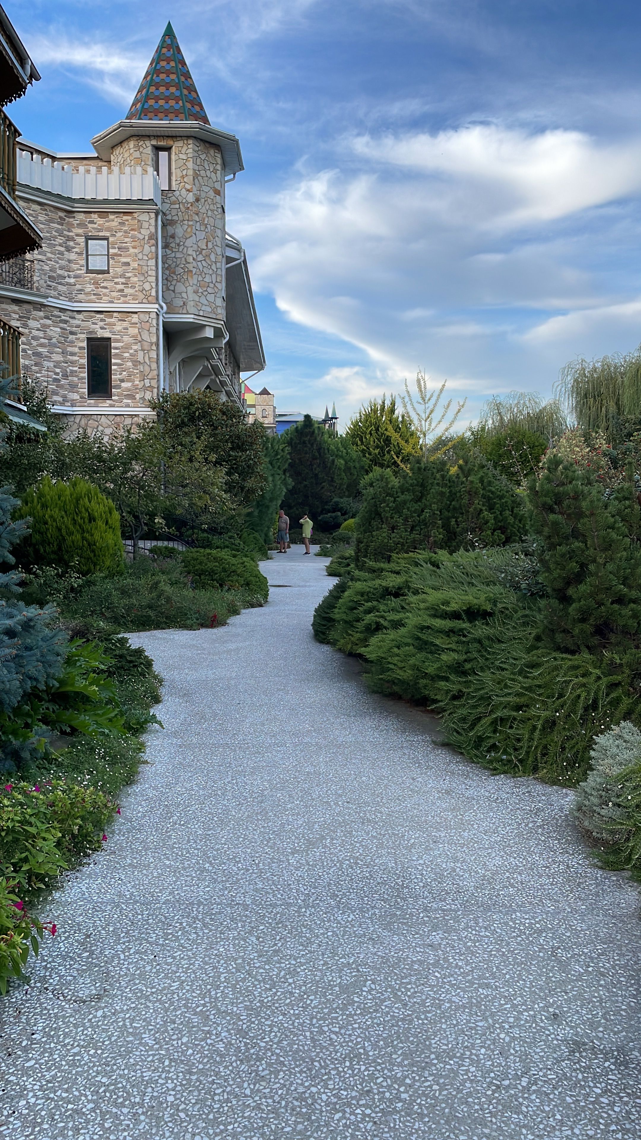 Stone Pathway by a Scenic Castle Under Blue Sky · Free Stock Photo