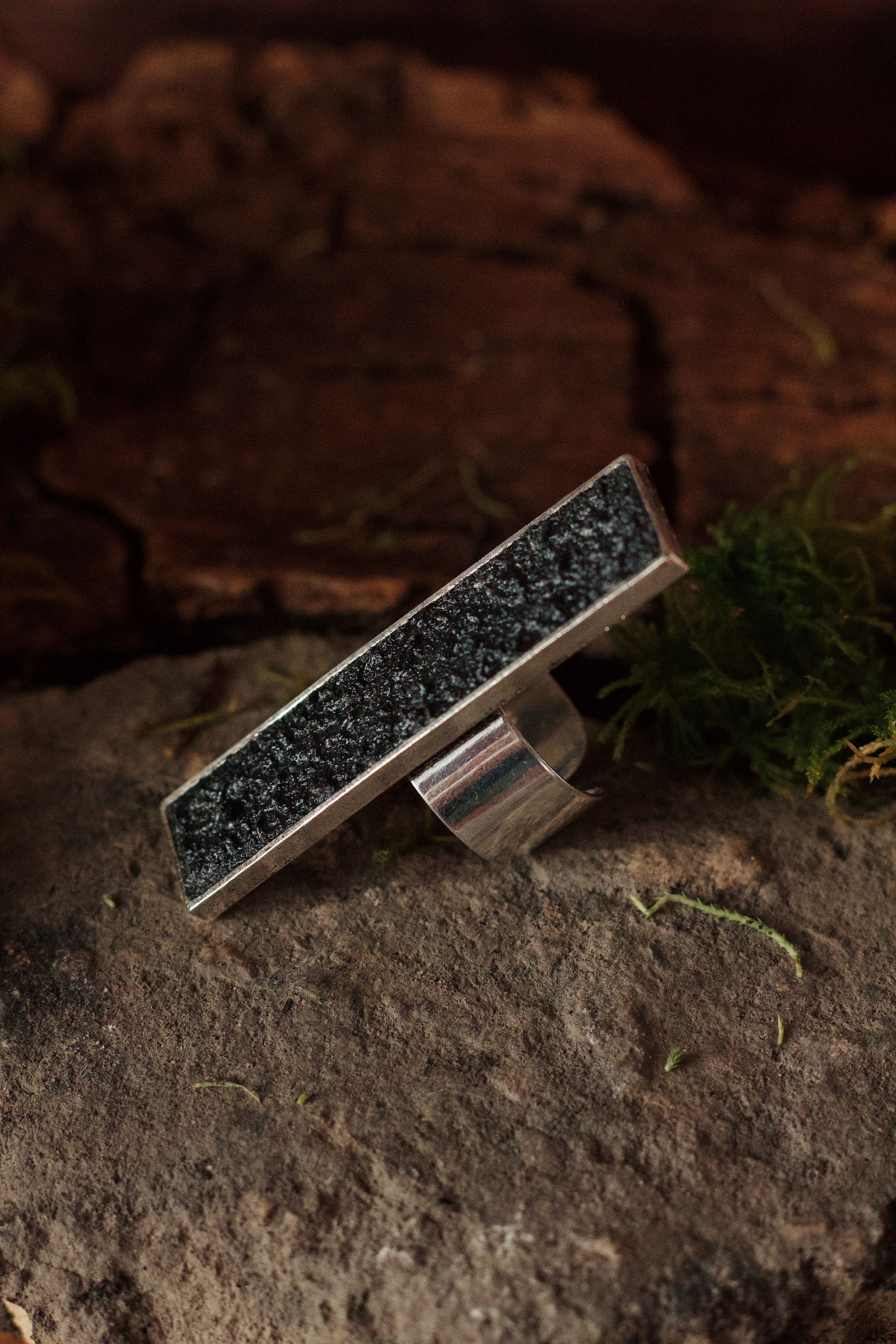 Elegant Silver and Stone Ring on Rustic Background · Free Stock Photo