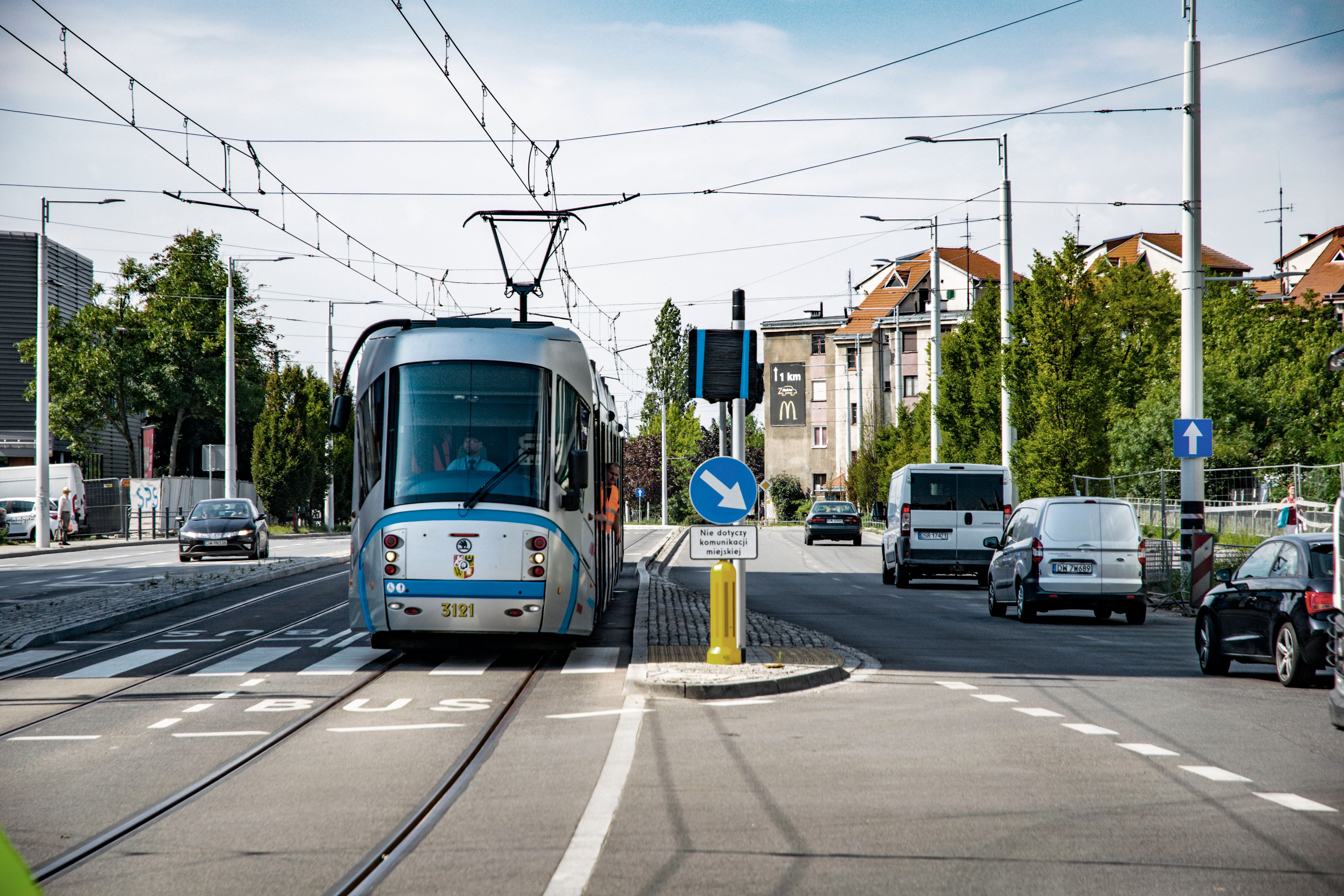 Modern Tram Navigating Wrocław's Urban Streets · Free Stock Photo