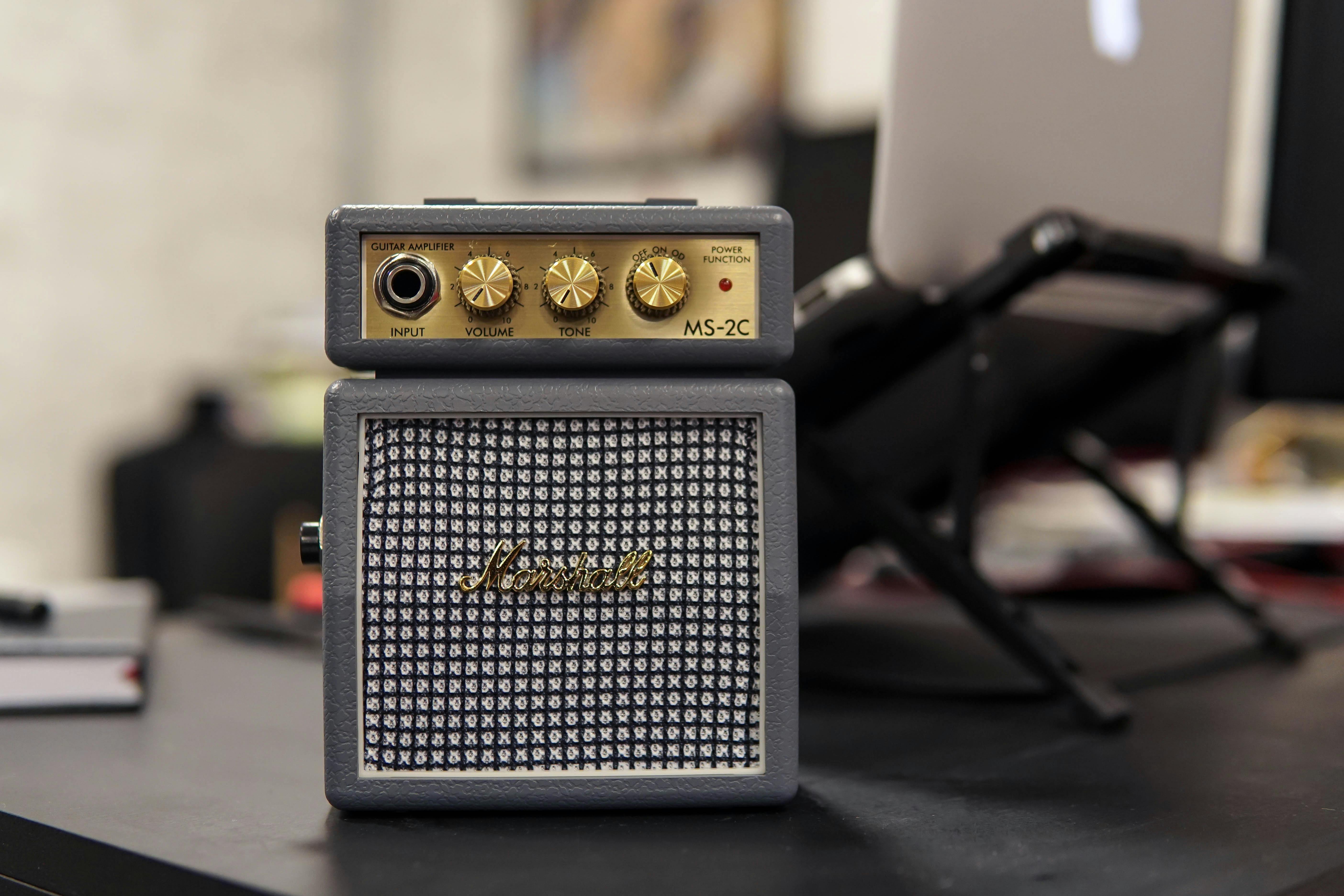 Compact Marshall Guitar Amplifier in Office Setting · Free Stock Photo