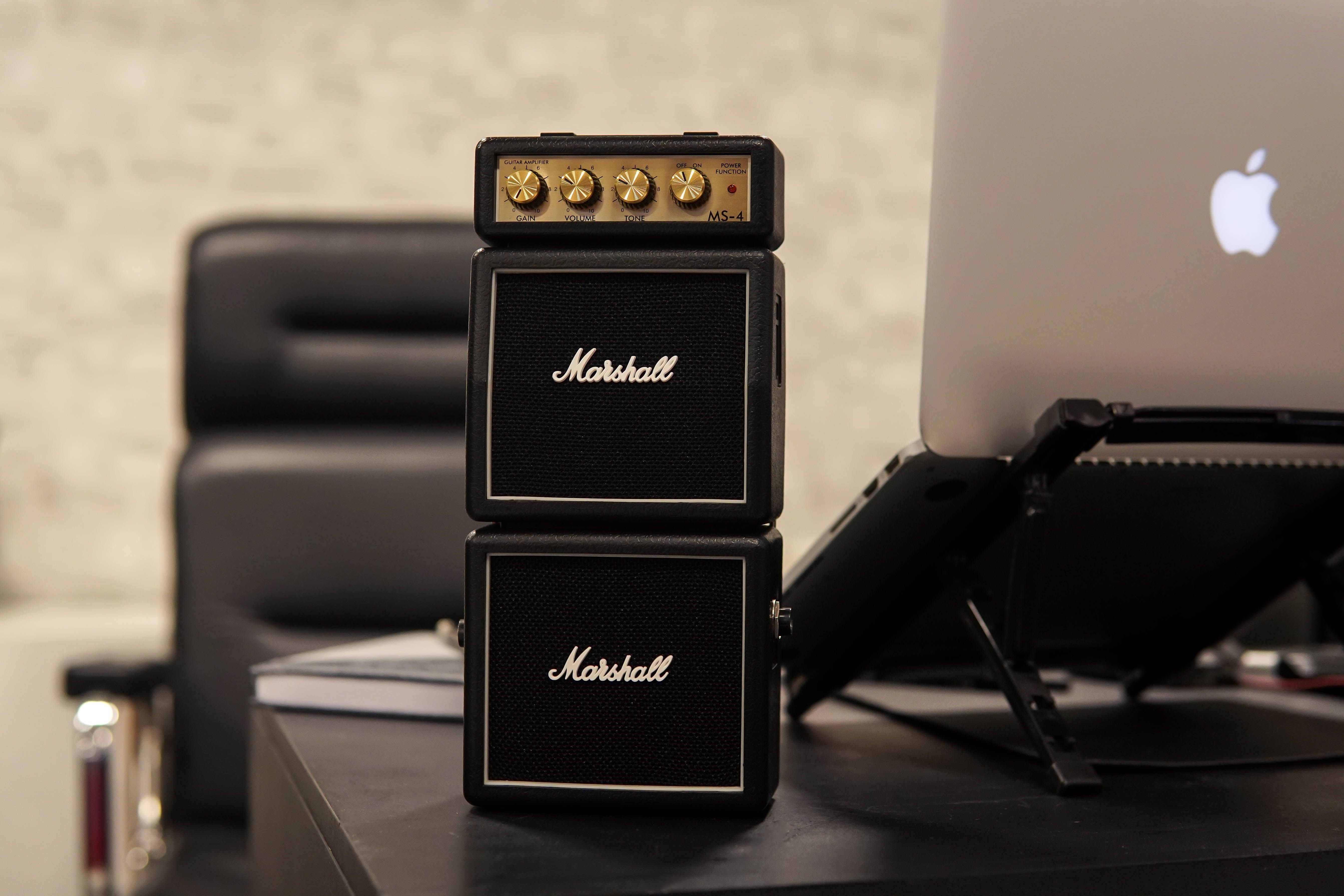 Compact Marshall Amp with Laptop and Office Chair · Free Stock Photo