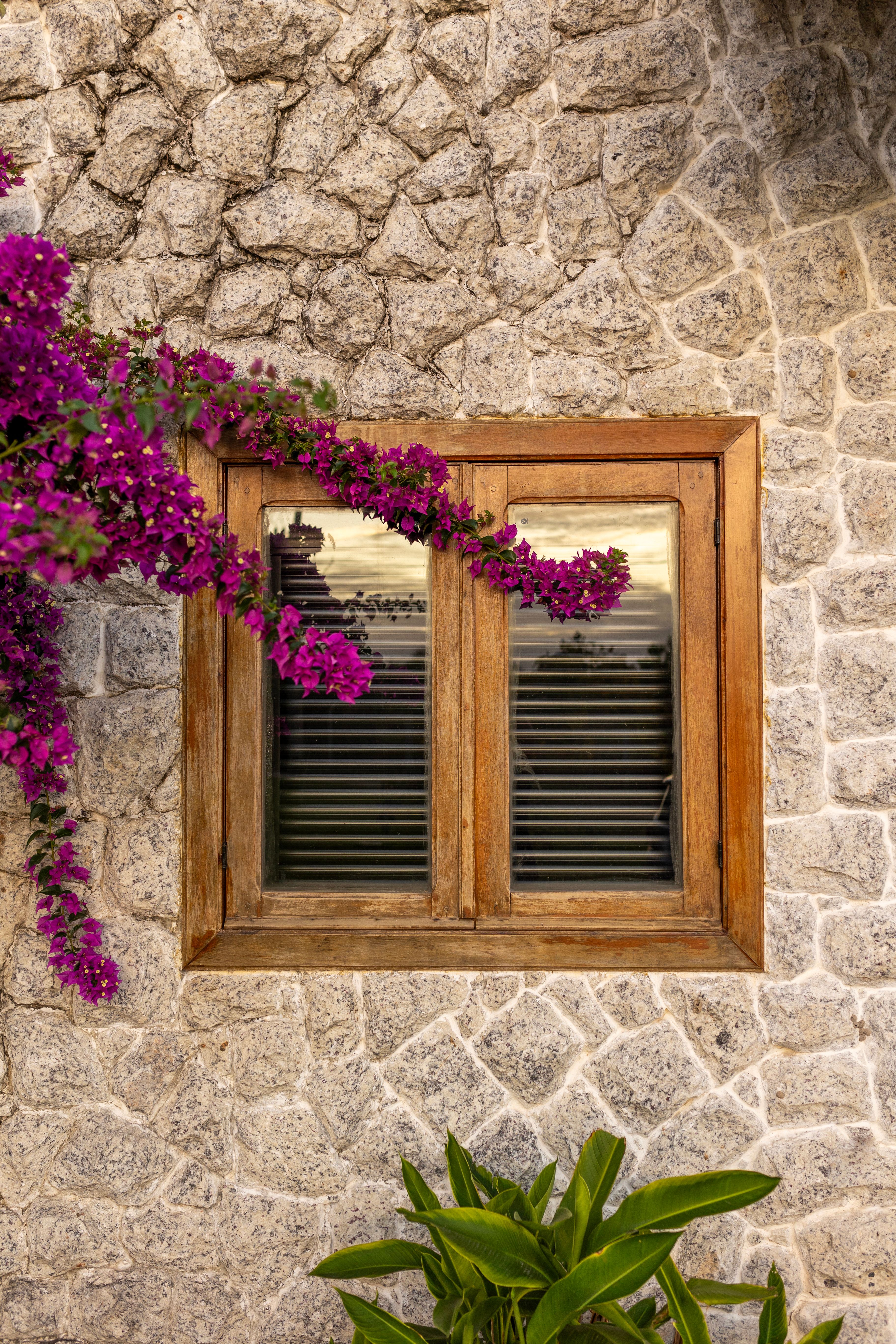Charming Stone Wall with Wooden Window Frame · Free Stock Photo