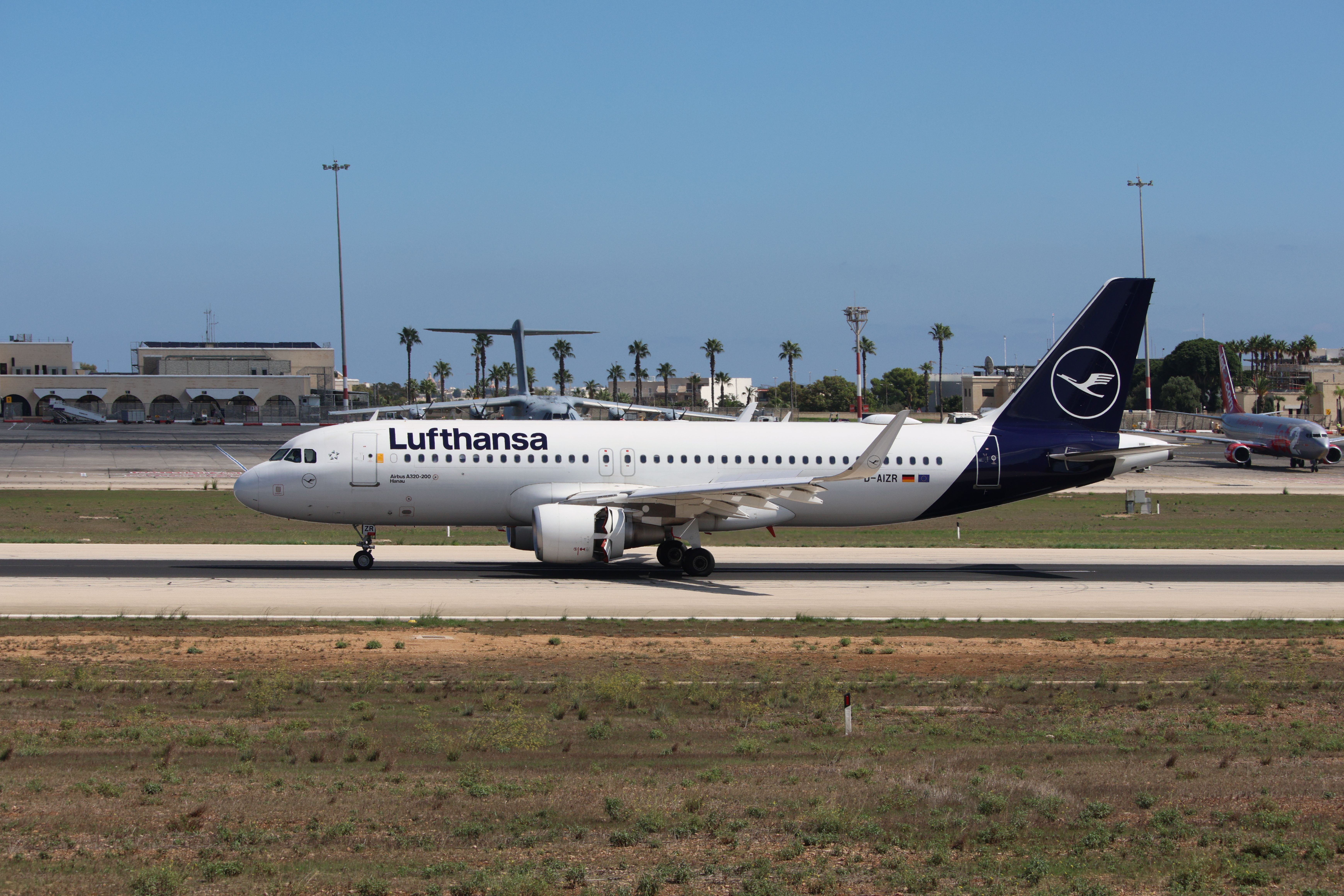 Lufthansa Airbus A320 on Airport Runway · Free Stock Photo