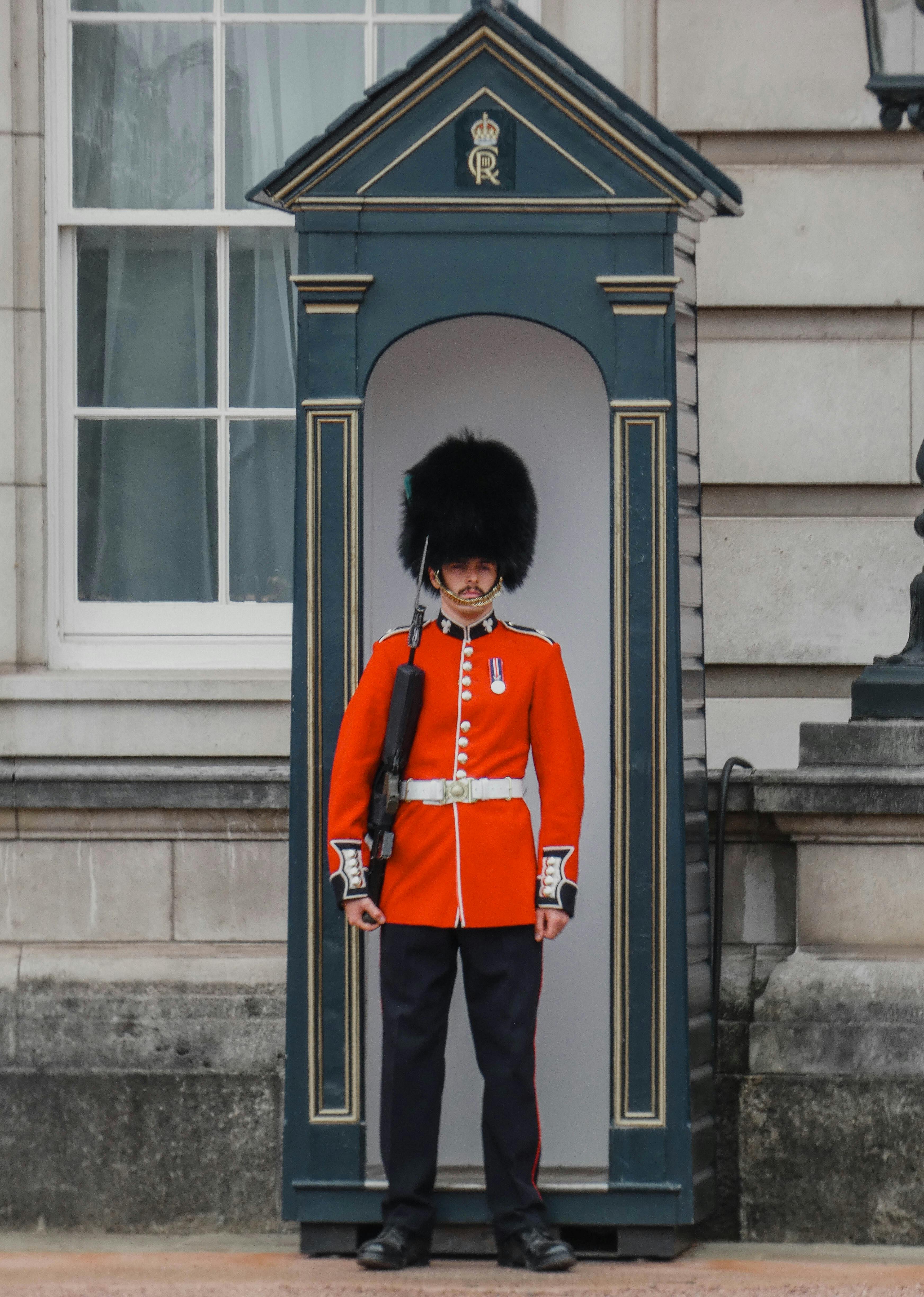 Royal Guard Standing Near Lamp Post · Free Stock Photo