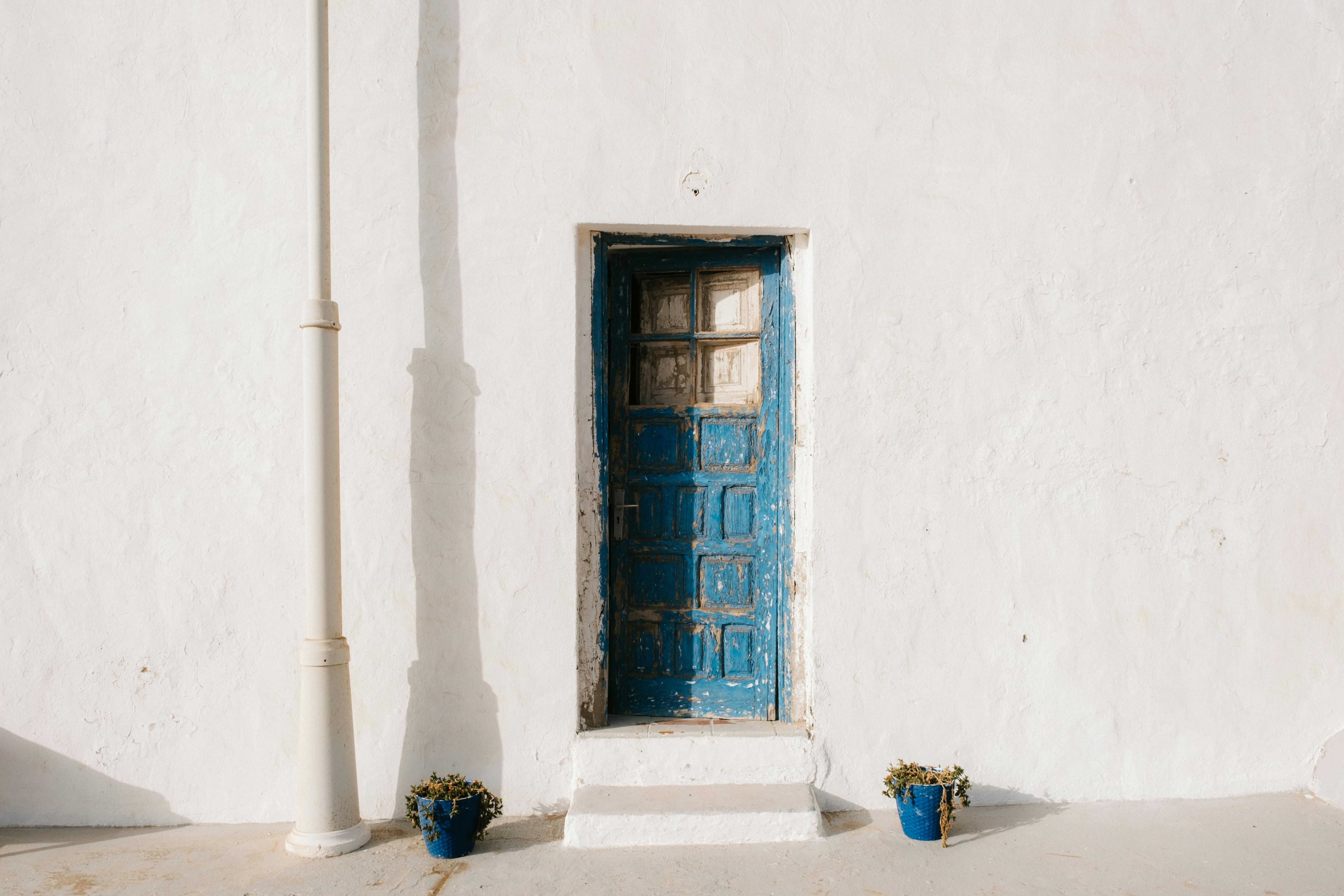 Rustic Blue Door on White Wall in Sunny Spain · Free Stock Photo