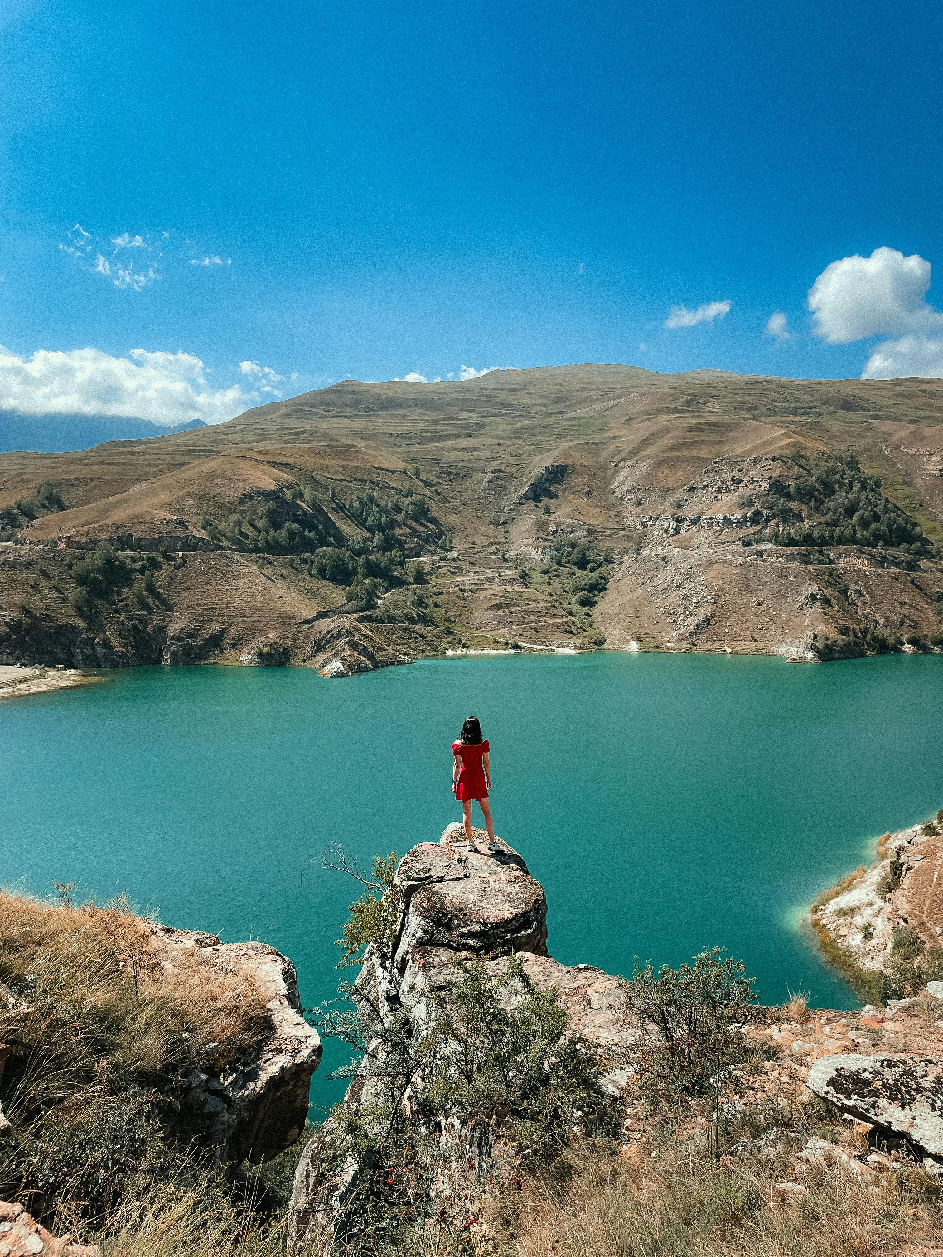 Woman Admiring Mountain Lake View · Free Stock Photo