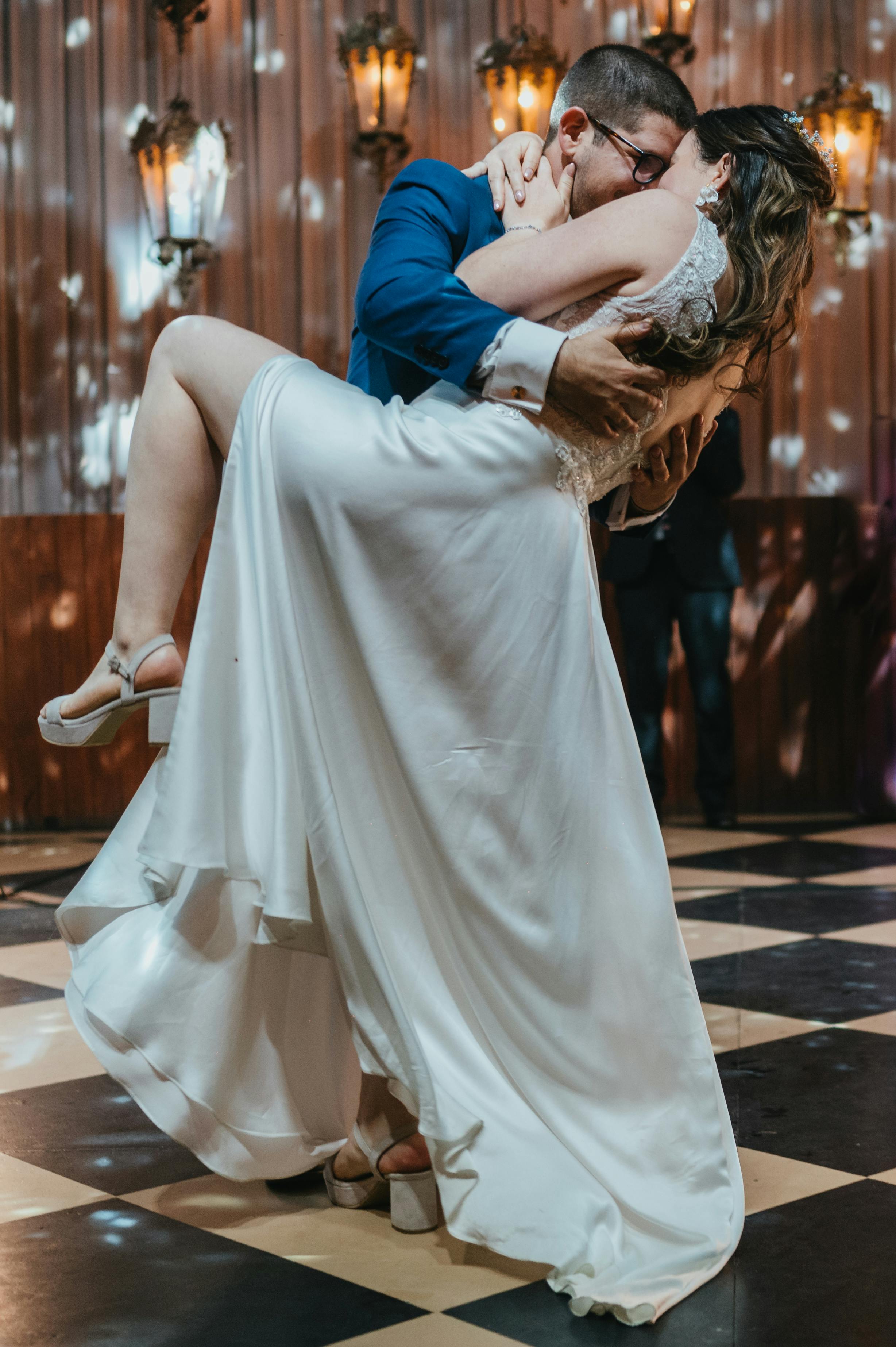 Bride and Groom Dancing by the River in the City · Free Stock Photo