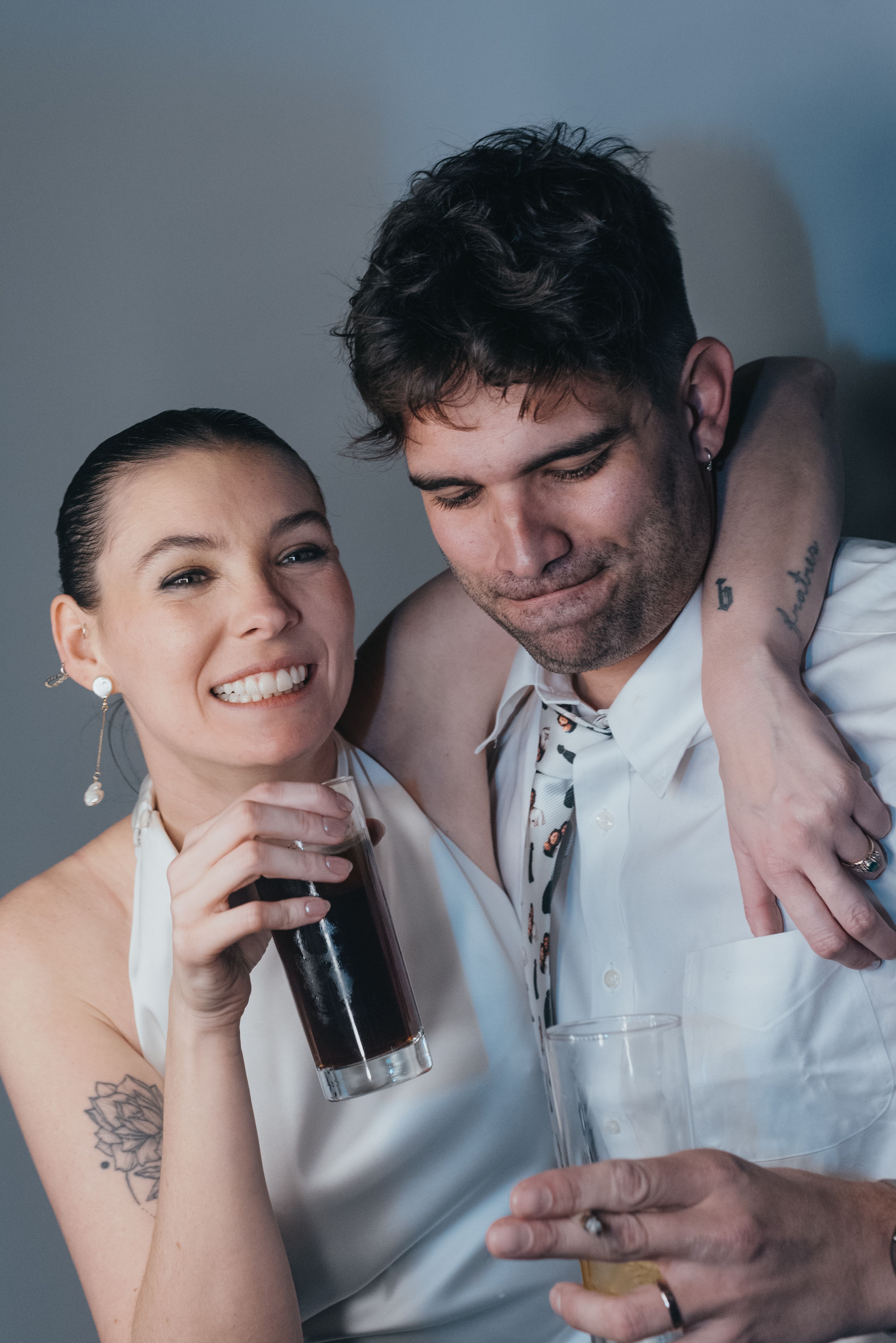 Couple Enjoying A Drink at Indoor Gathering · Free Stock Photo