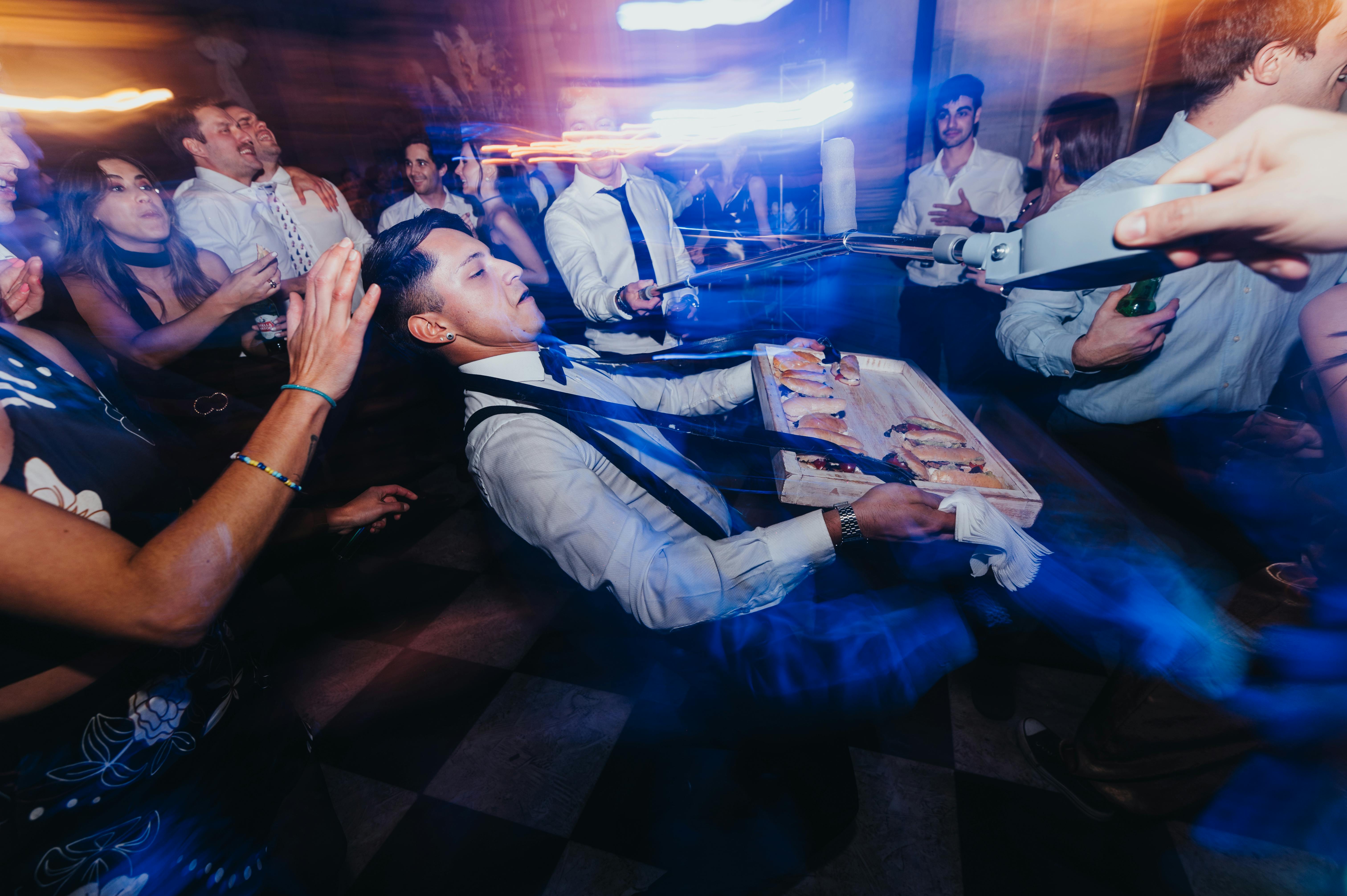 Lively Party Scene with Dancing and Snacks · Free Stock Photo