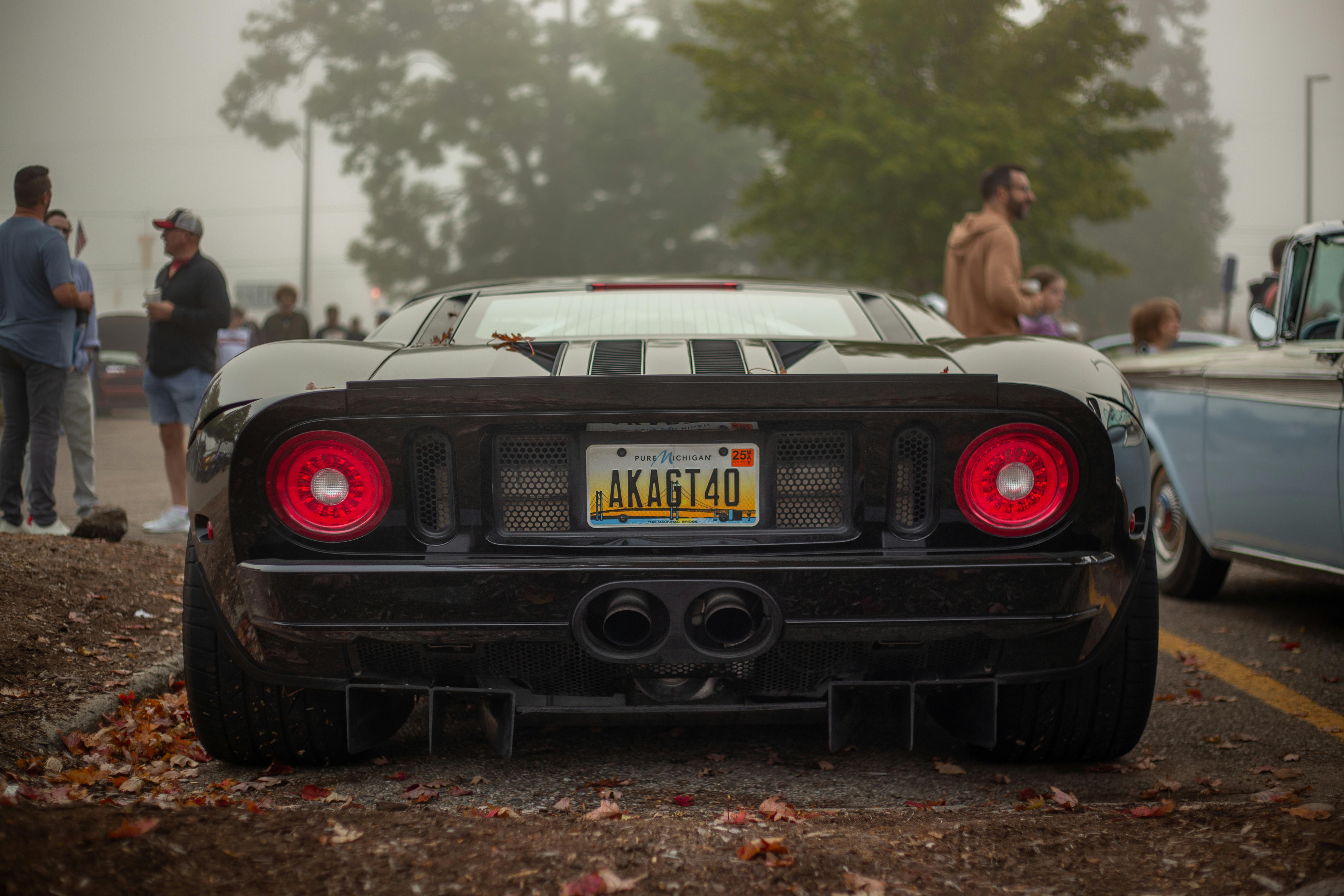 Black Sports Car at Outdoor Auto Show · Free Stock Photo