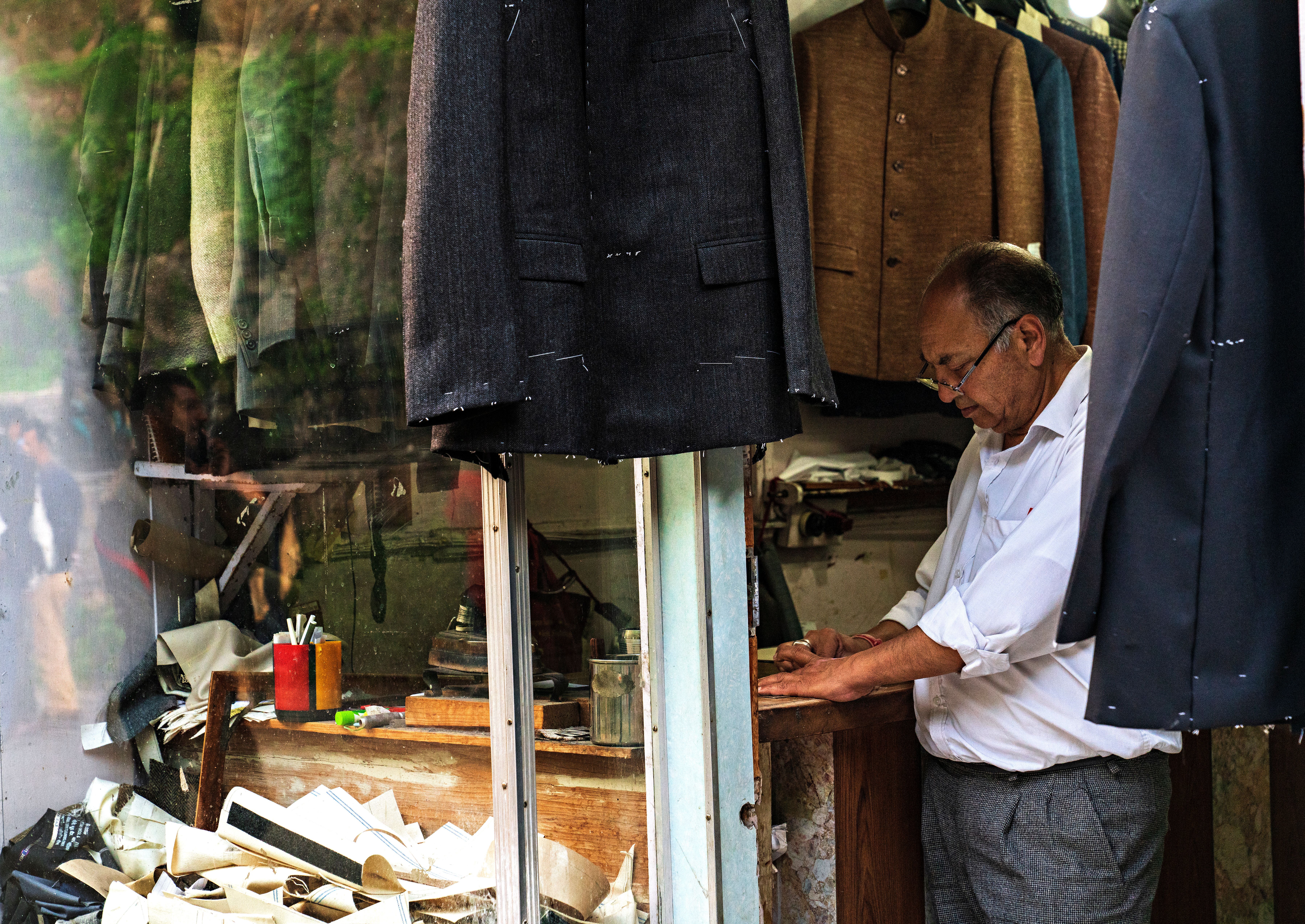Tailor Working in Traditional Sewing Shop · Free Stock Photo