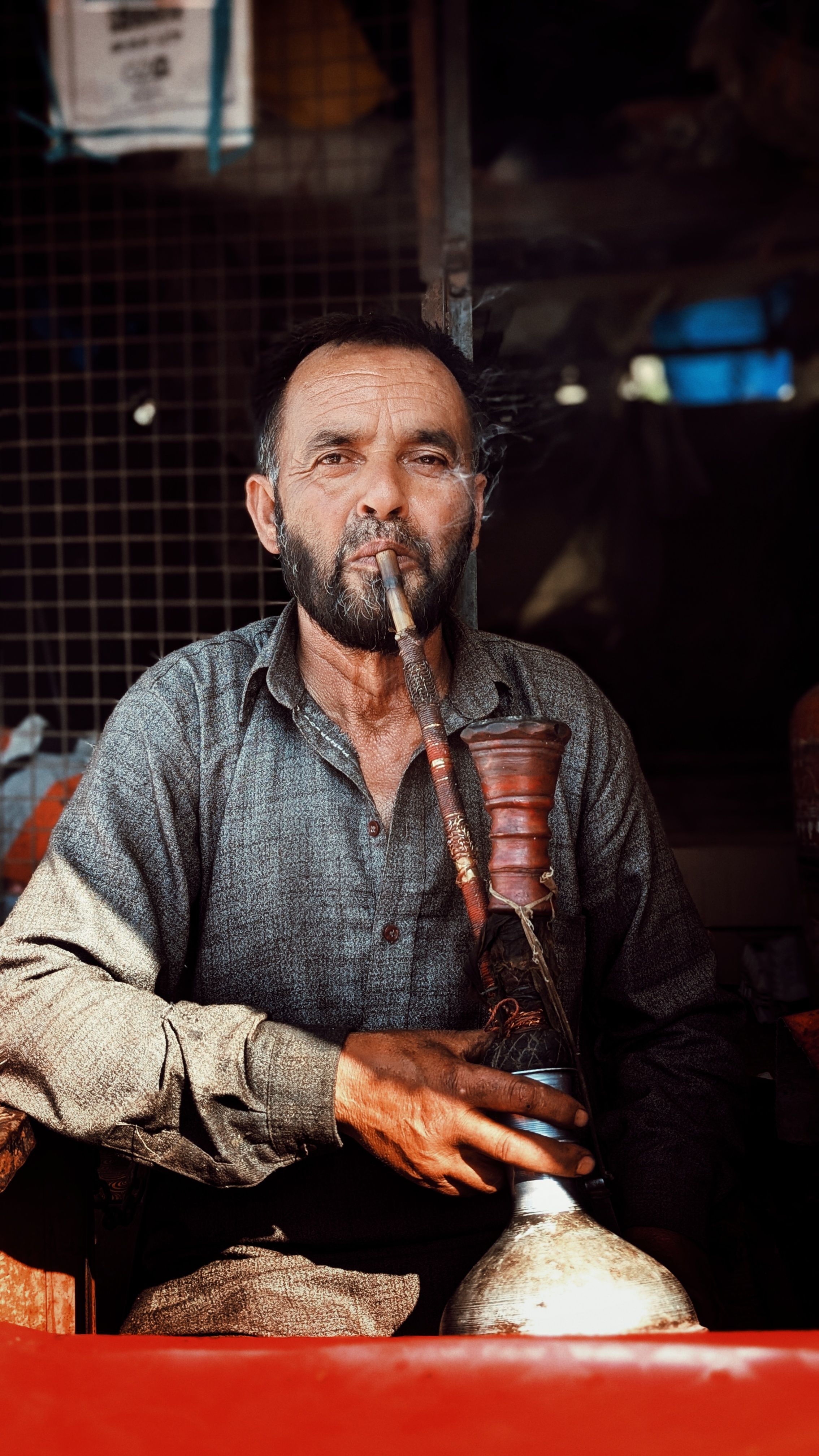 Portrait of a Man Smoking Hookah in Pahalgam · Free Stock Photo