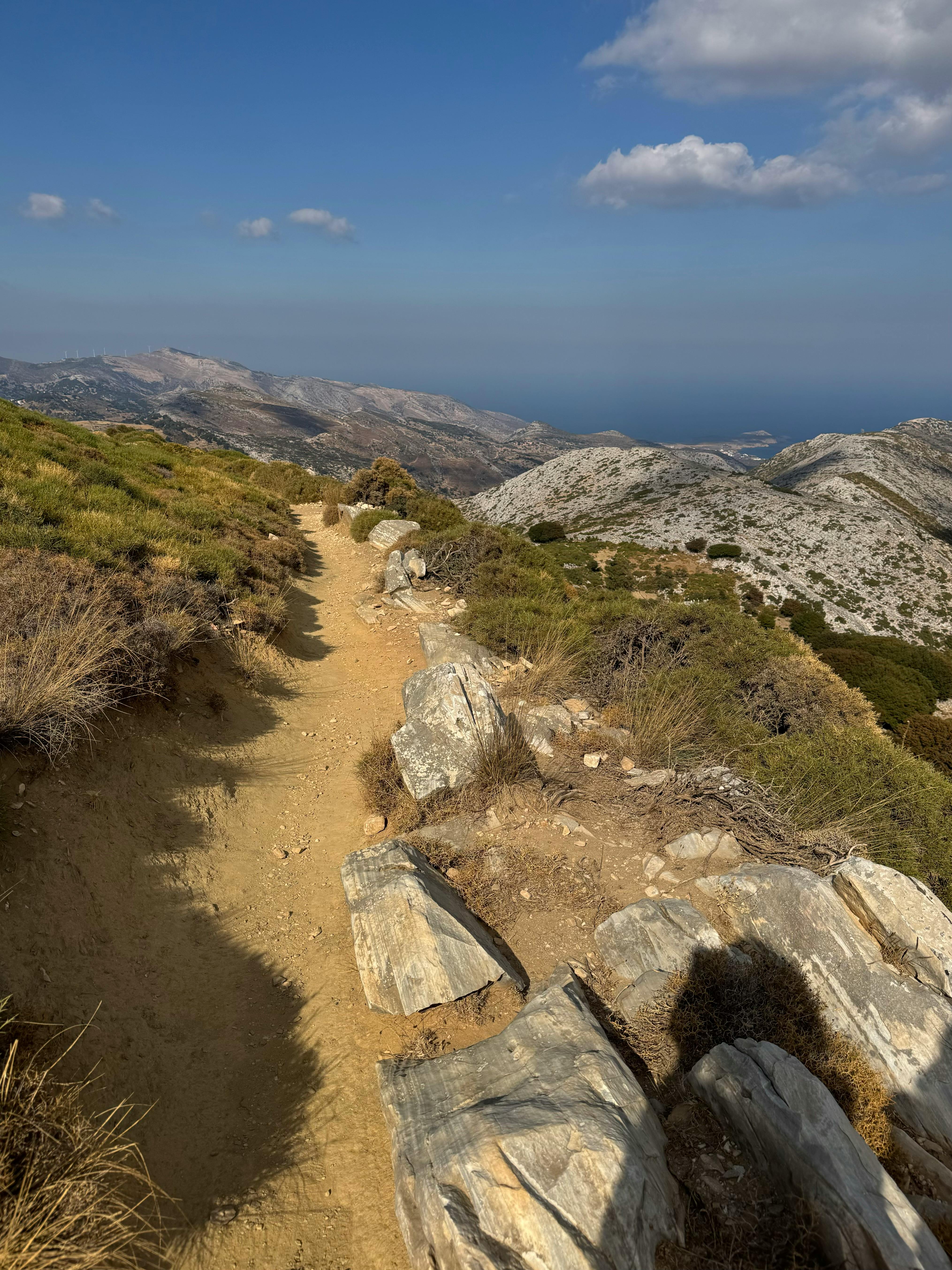 Scenic Mountain Path with Distant Ocean View · Free Stock Photo