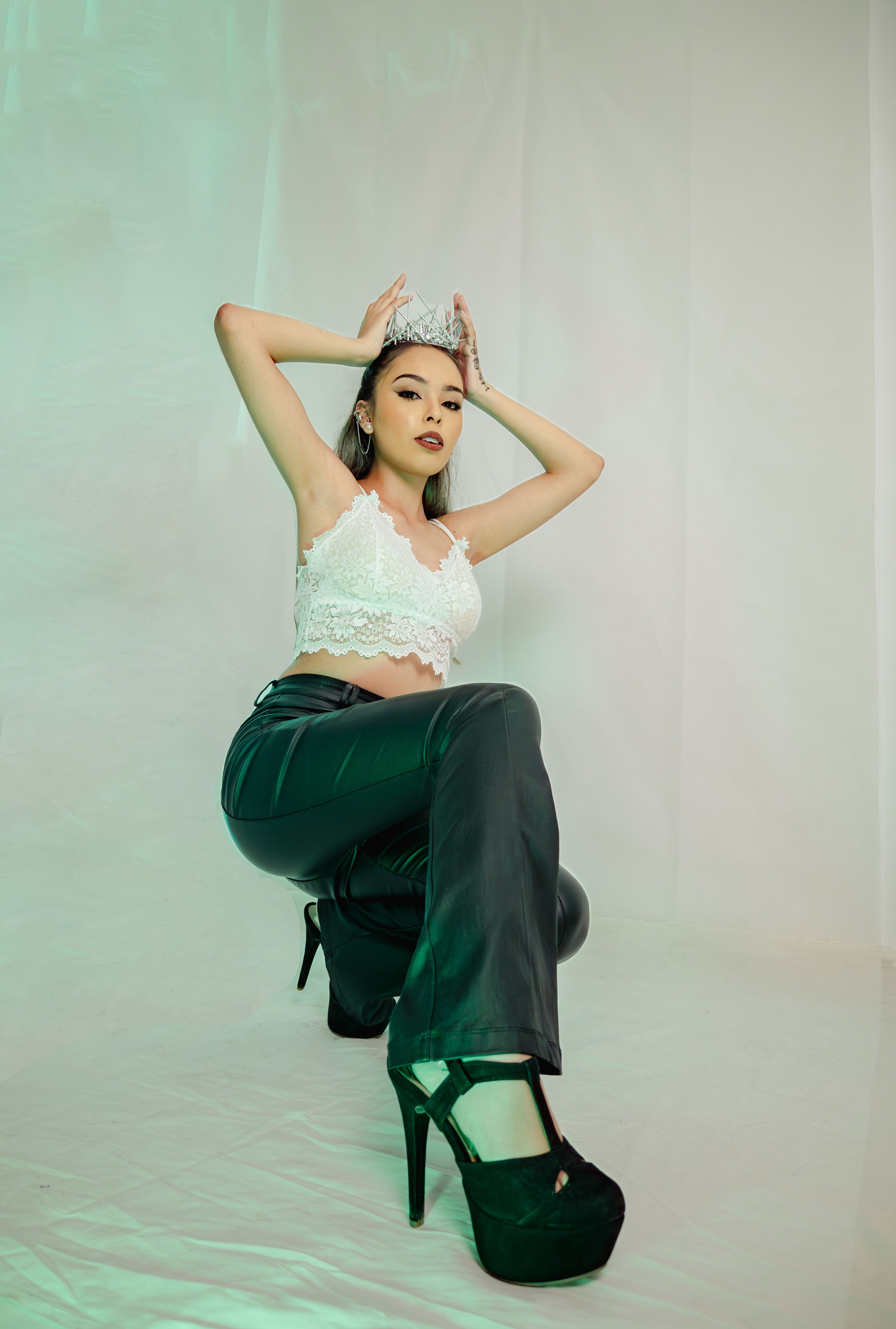 Chic Fashion Model Posing in Studio Setting · Free Stock Photo