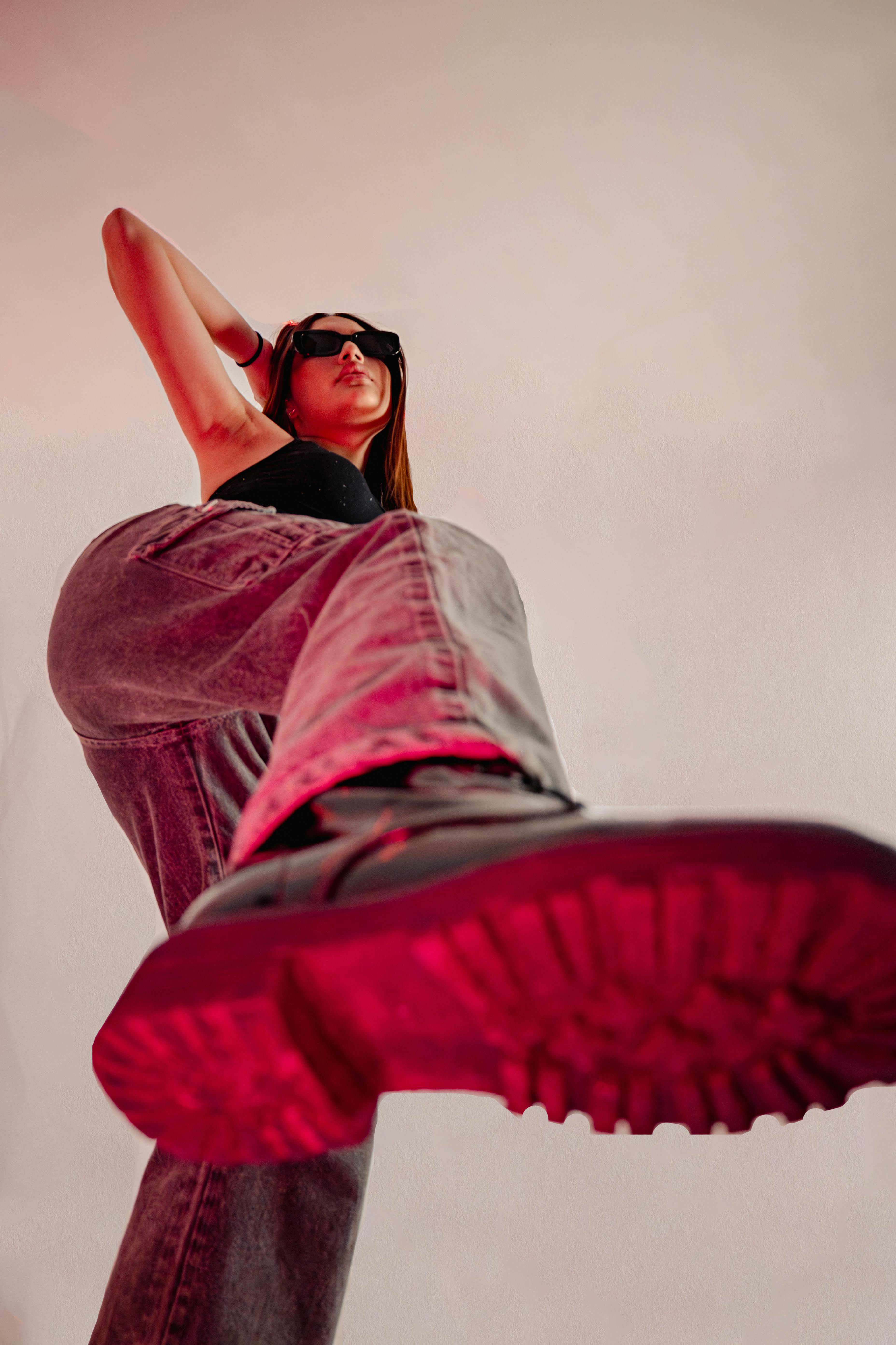 Dynamic Low Angle Portrait of a Confident Woman · Free Stock Photo