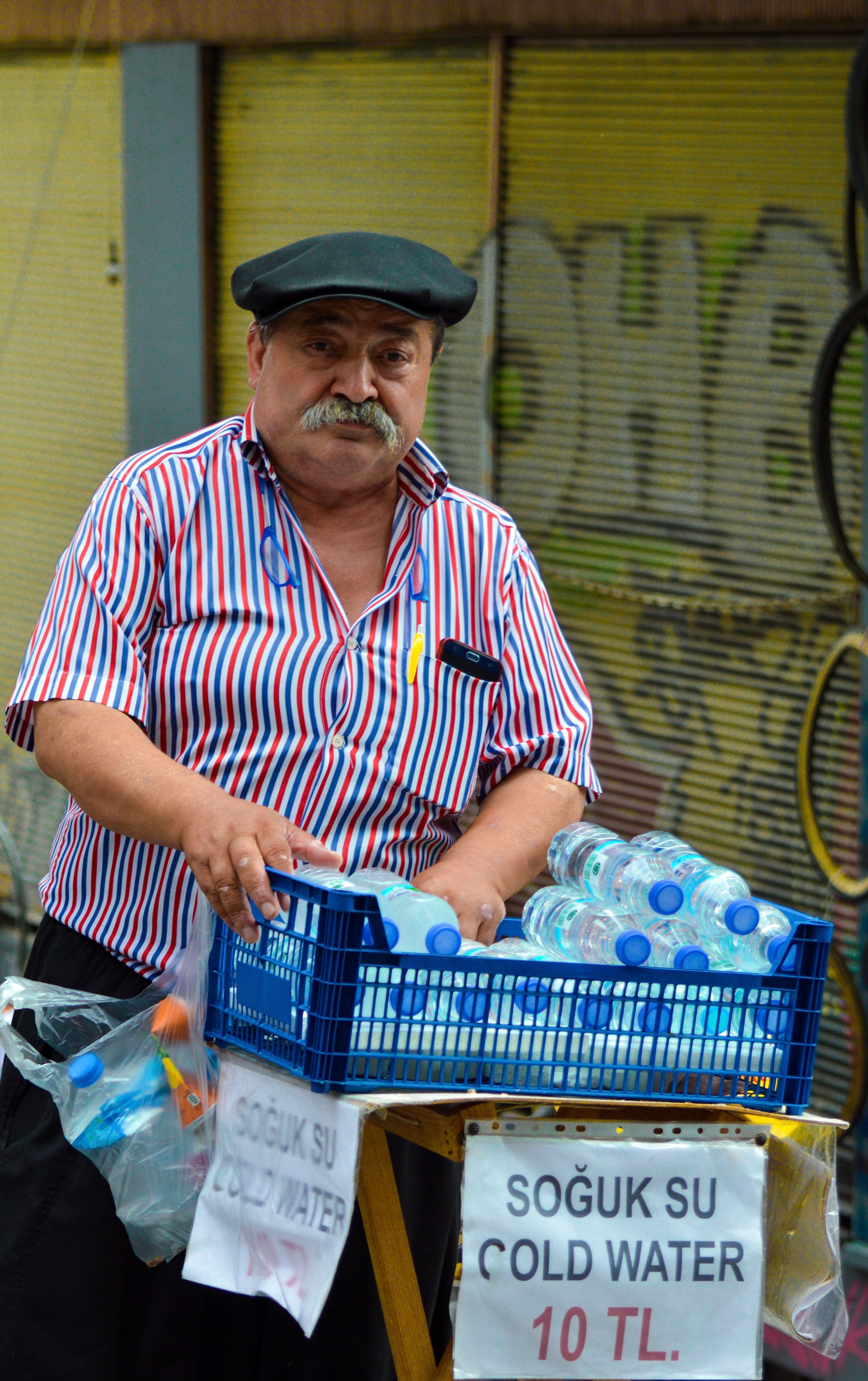Street Vendor Selling Cold Water in Istanbul · Free Stock Photo