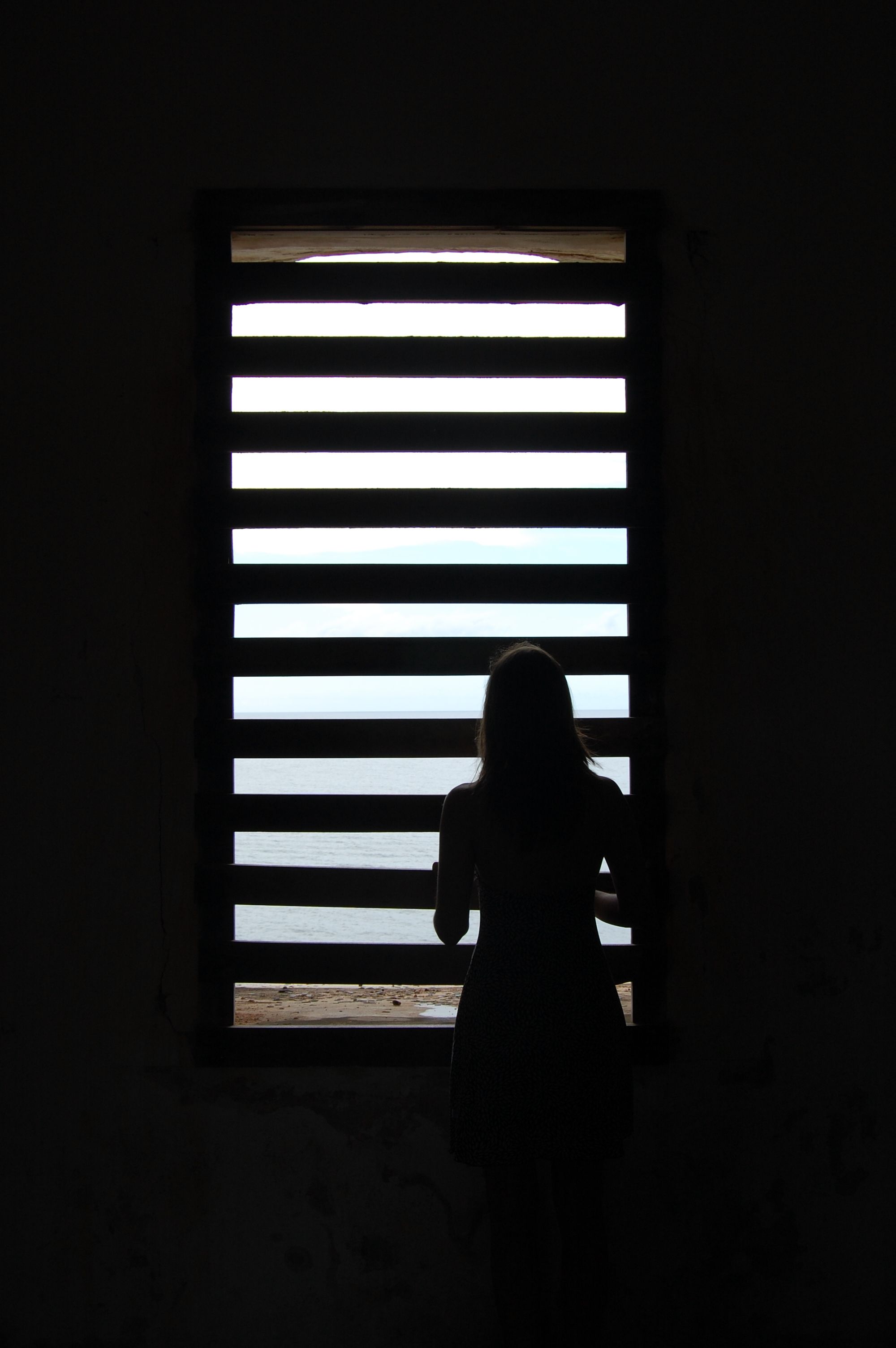 Silhouette View Through Historic Fort Window · Free Stock Photo