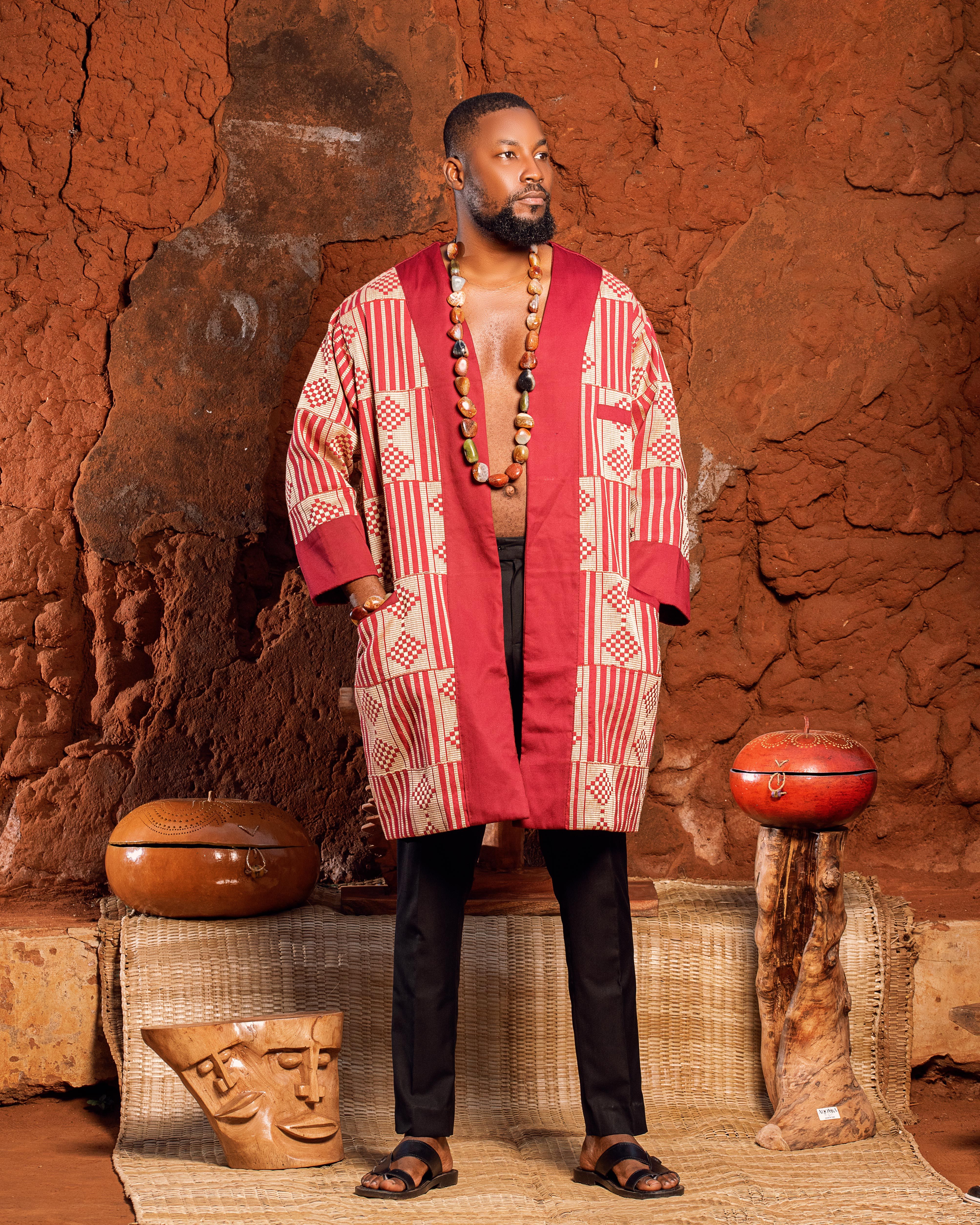 Traditional African Attire in Rustic Setting · Free Stock Photo