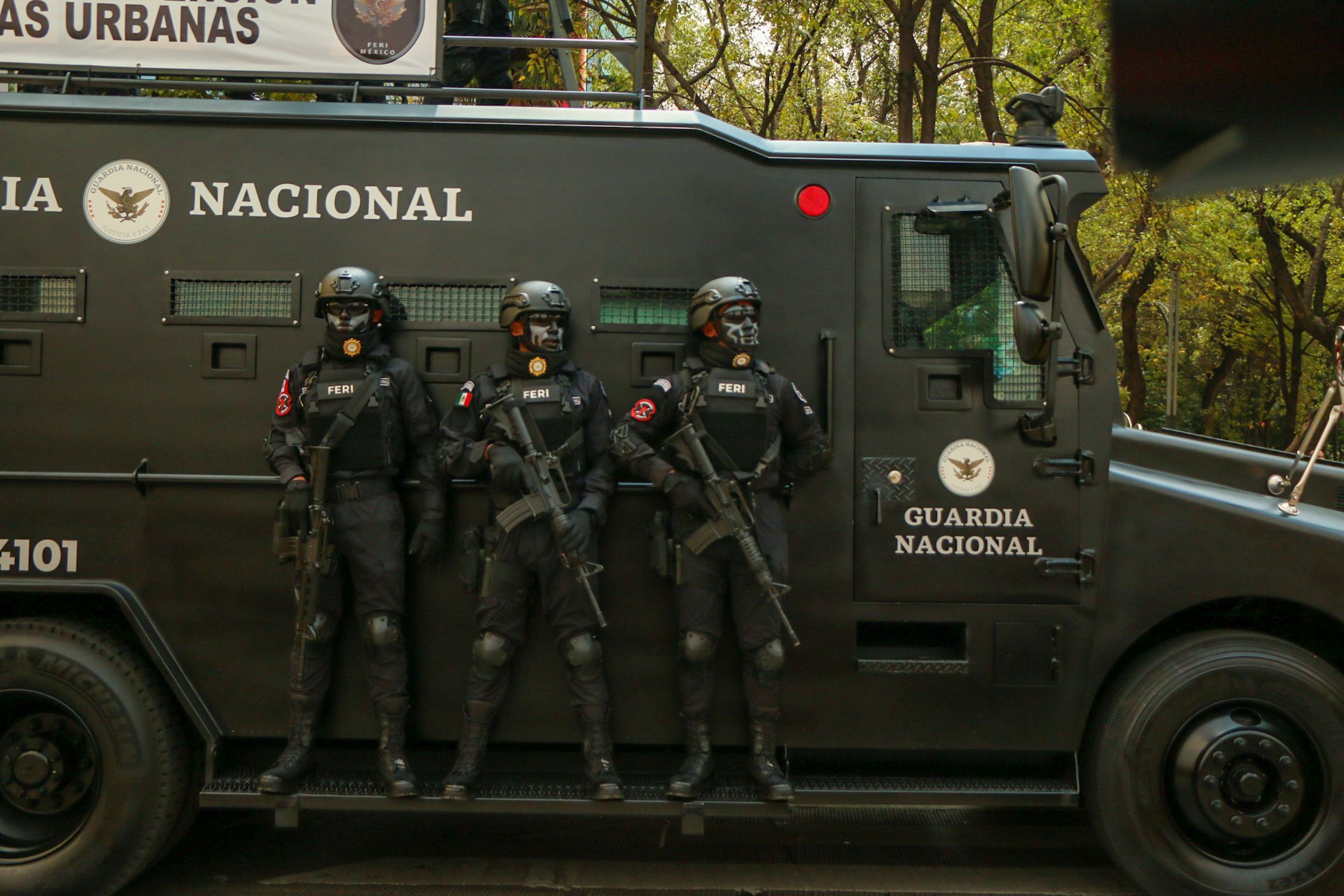 Guardia Nacional Officers Beside Armored Vehicle · Free Stock Photo