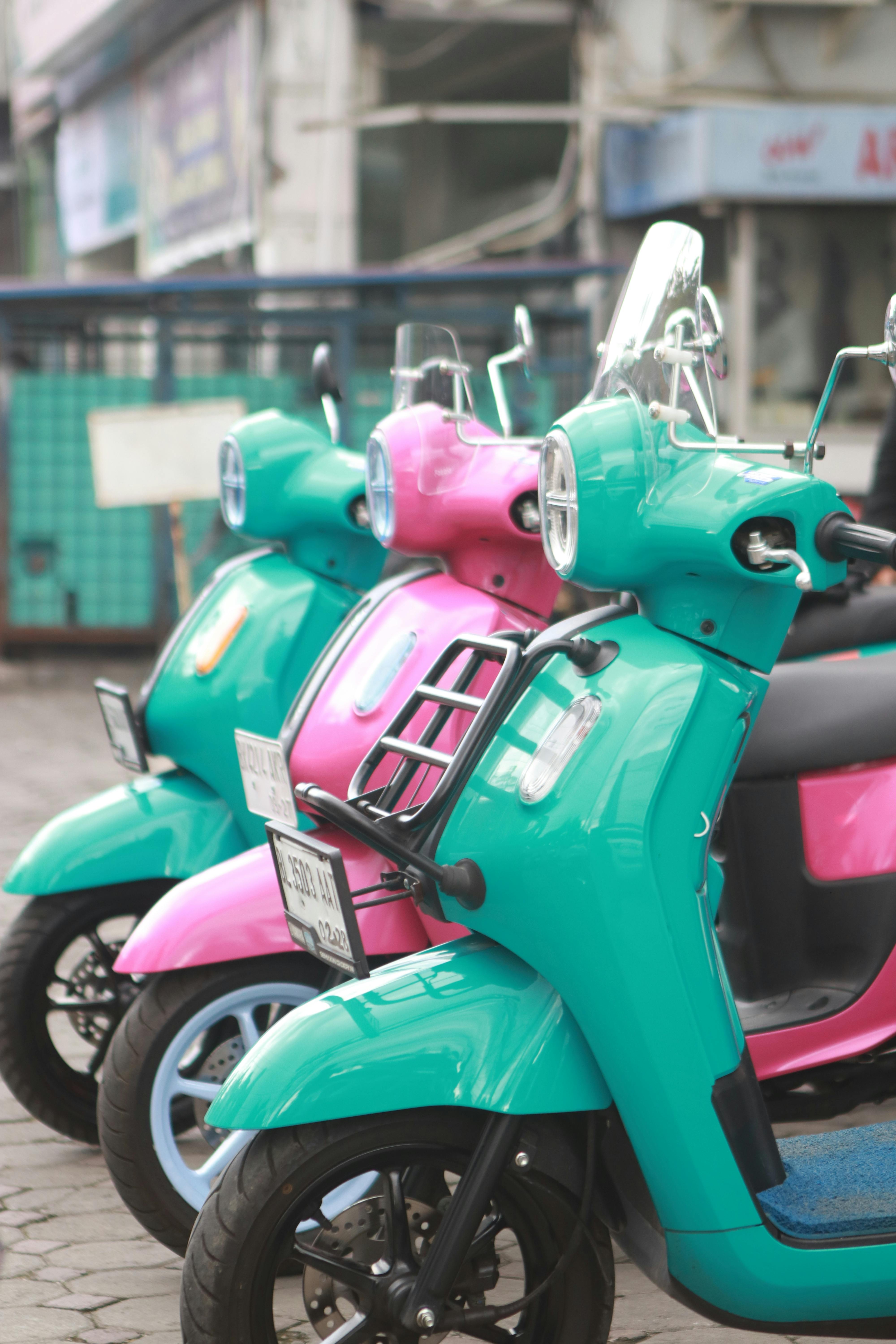 Vibrant Retro Scooters Lined Up Outdoors · Free Stock Photo