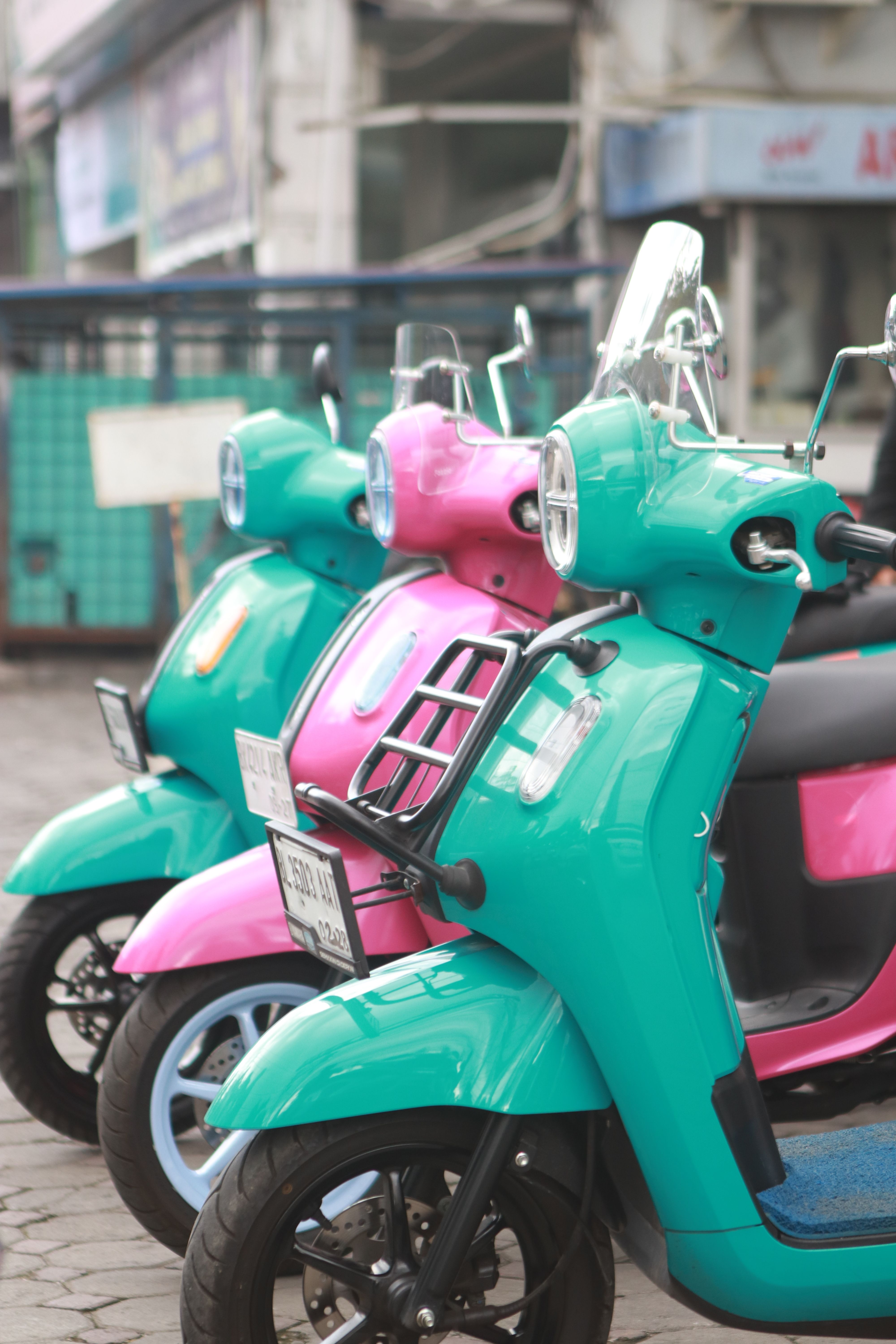 Vibrant Retro Scooters Lined Up Outdoors · Free Stock Photo