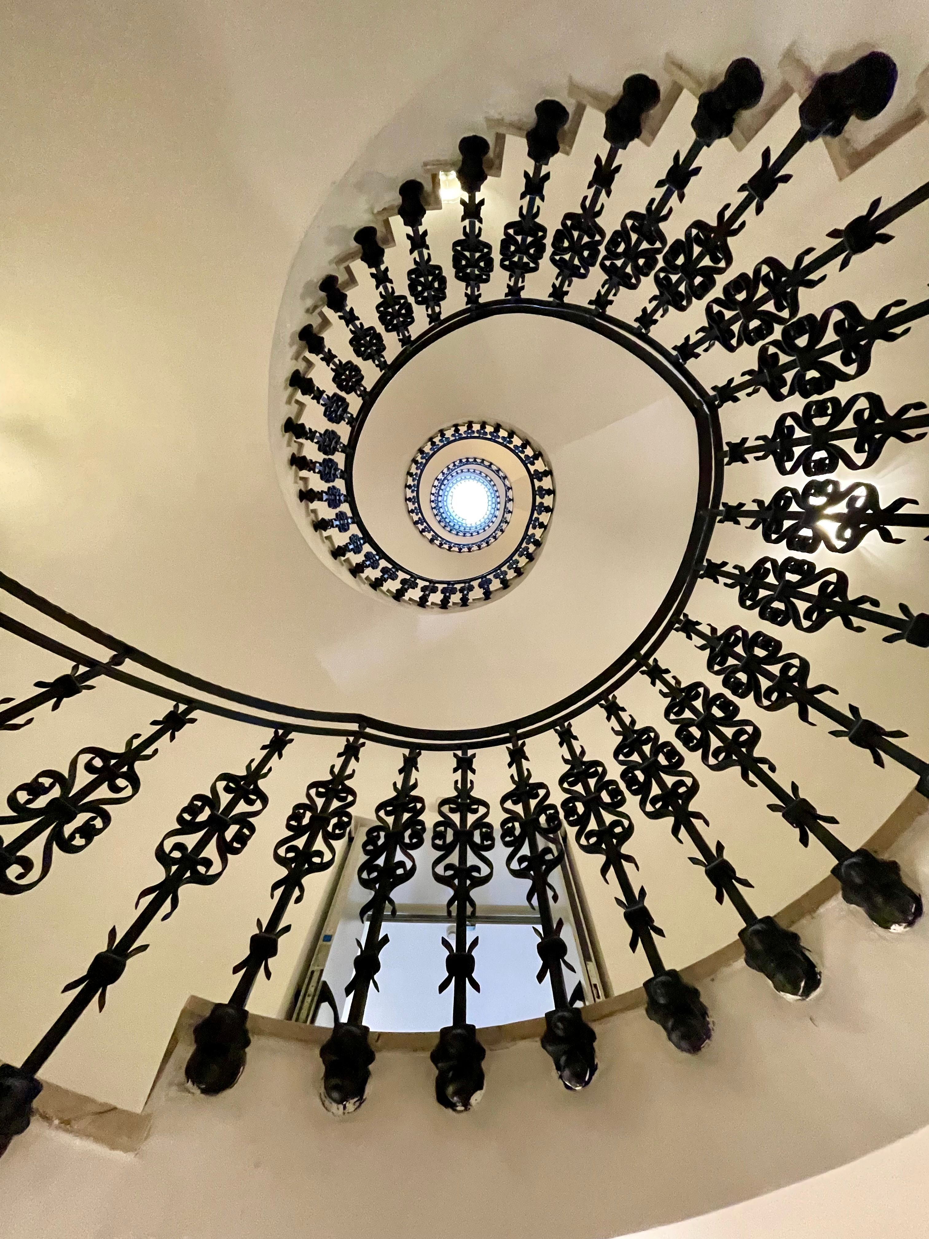 Intricate Spiral Staircase with Ornate Railing · Free Stock Photo