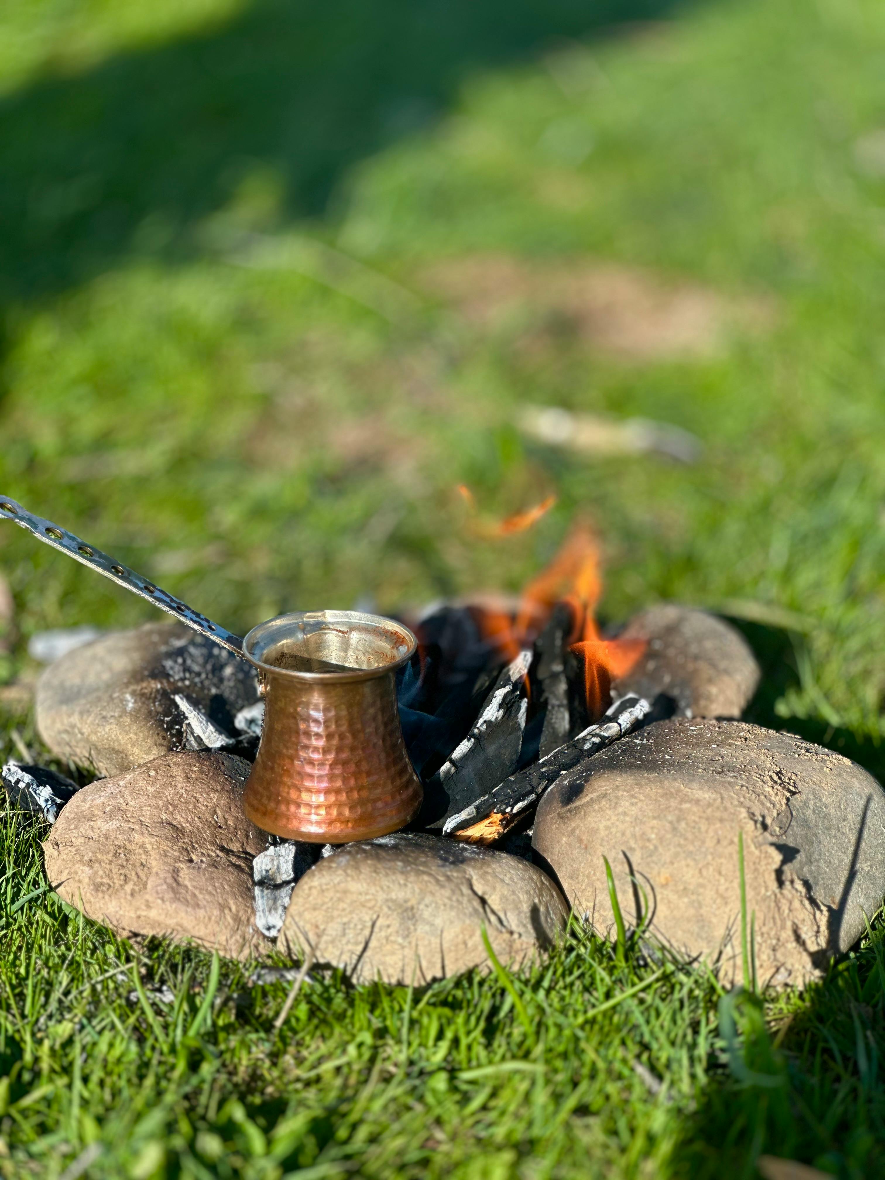 Rustic Outdoor Coffee Brewing on Stone Fire Pit · Free Stock Photo