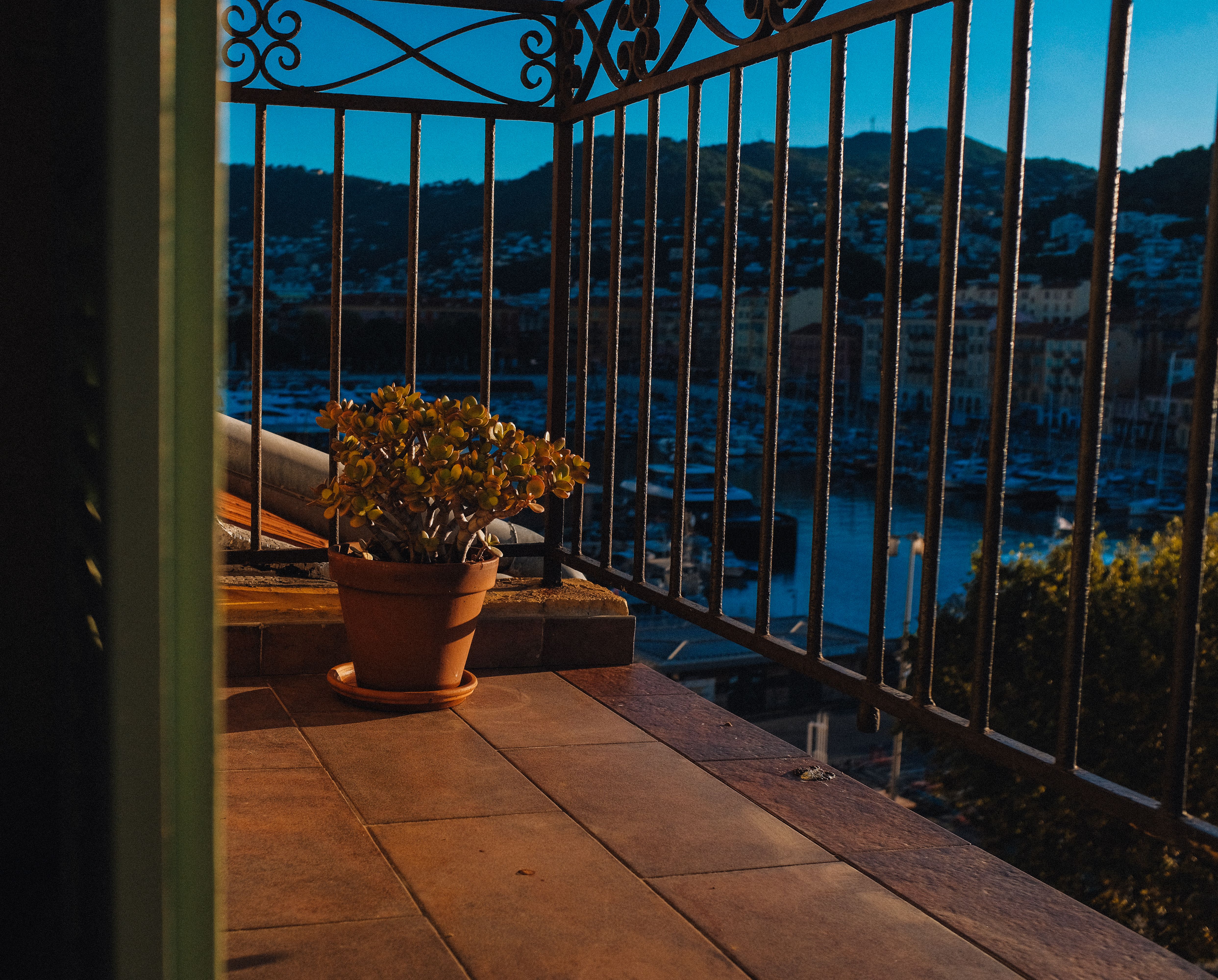 Scenic Balcony Overlooking Harbor at Sunset · Free Stock Photo