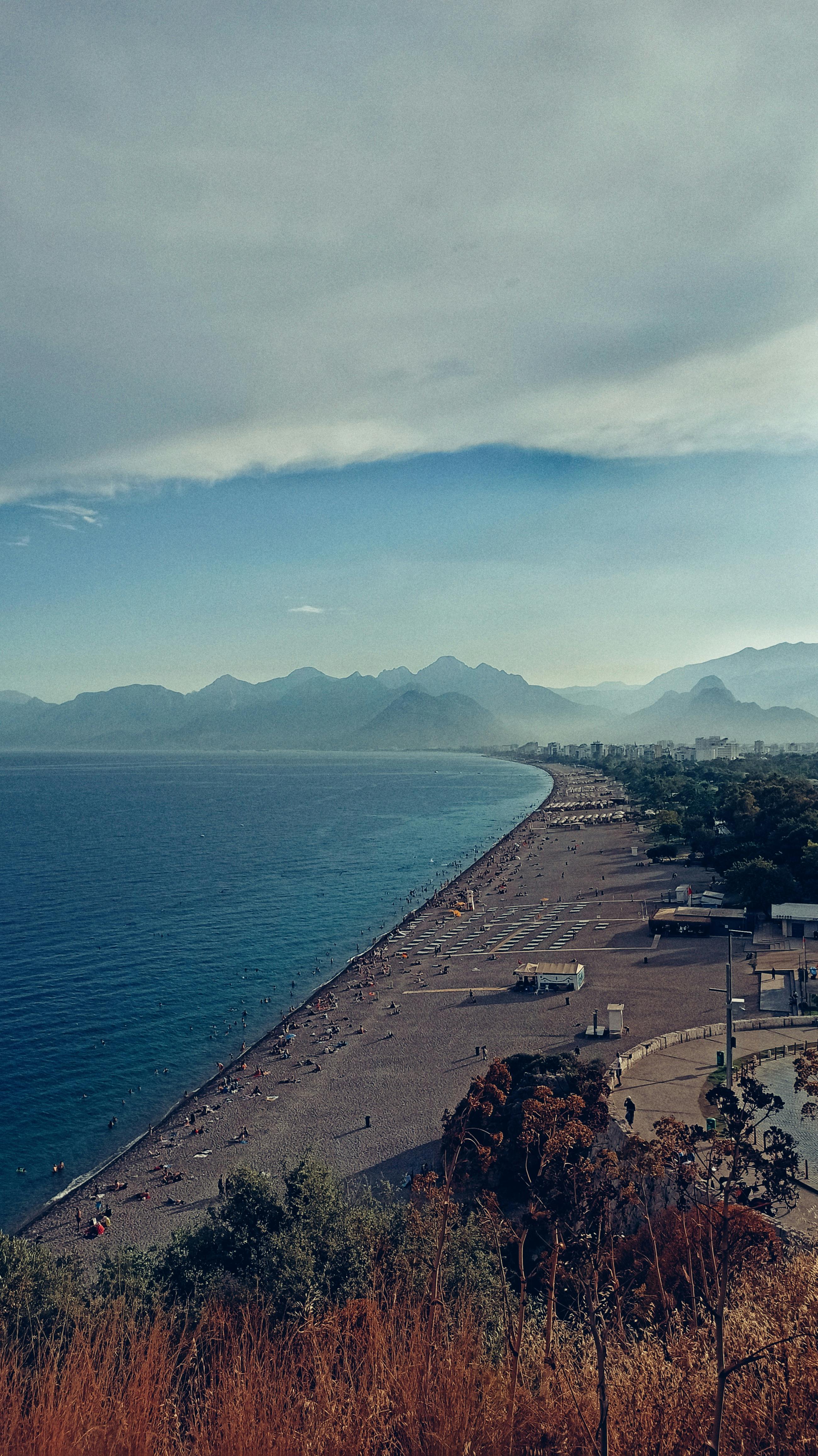 Scenic View of a Serene Coastal Beachfront · Free Stock Photo
