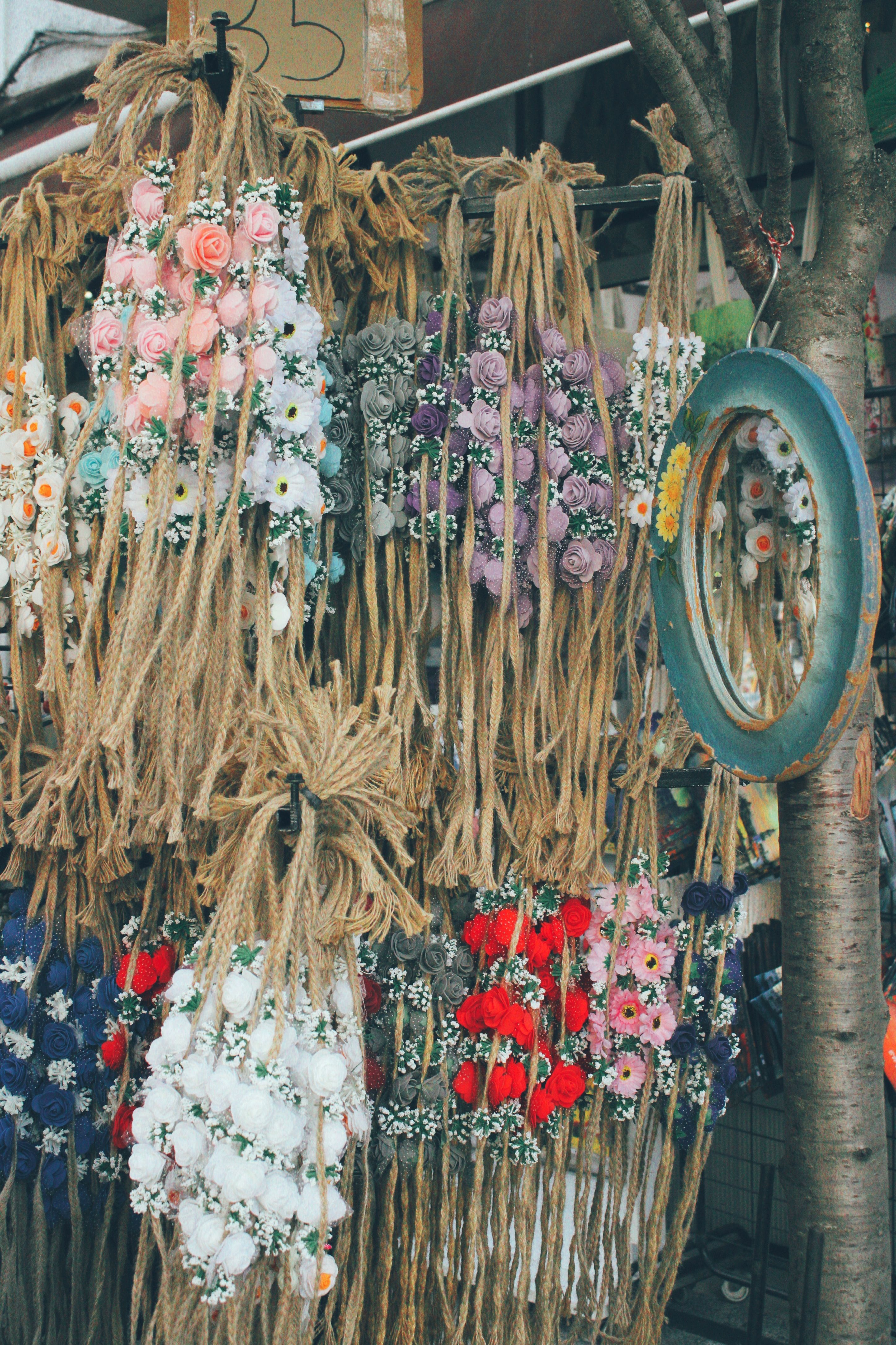 Colorful Floral Handmade Decorations on Display · Free Stock Photo