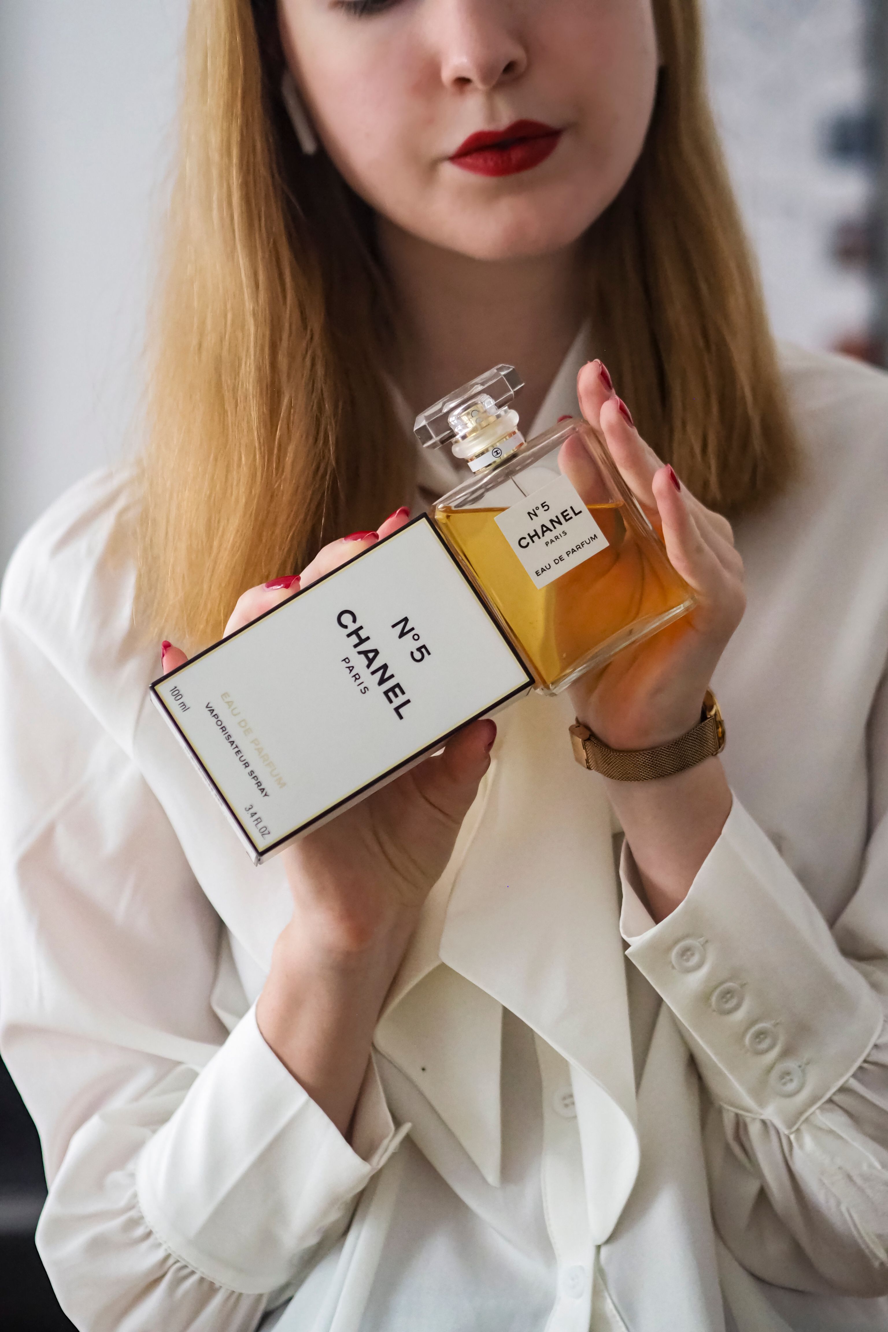 Woman Holding Luxury Perfume Bottle and Box · Free Stock Photo