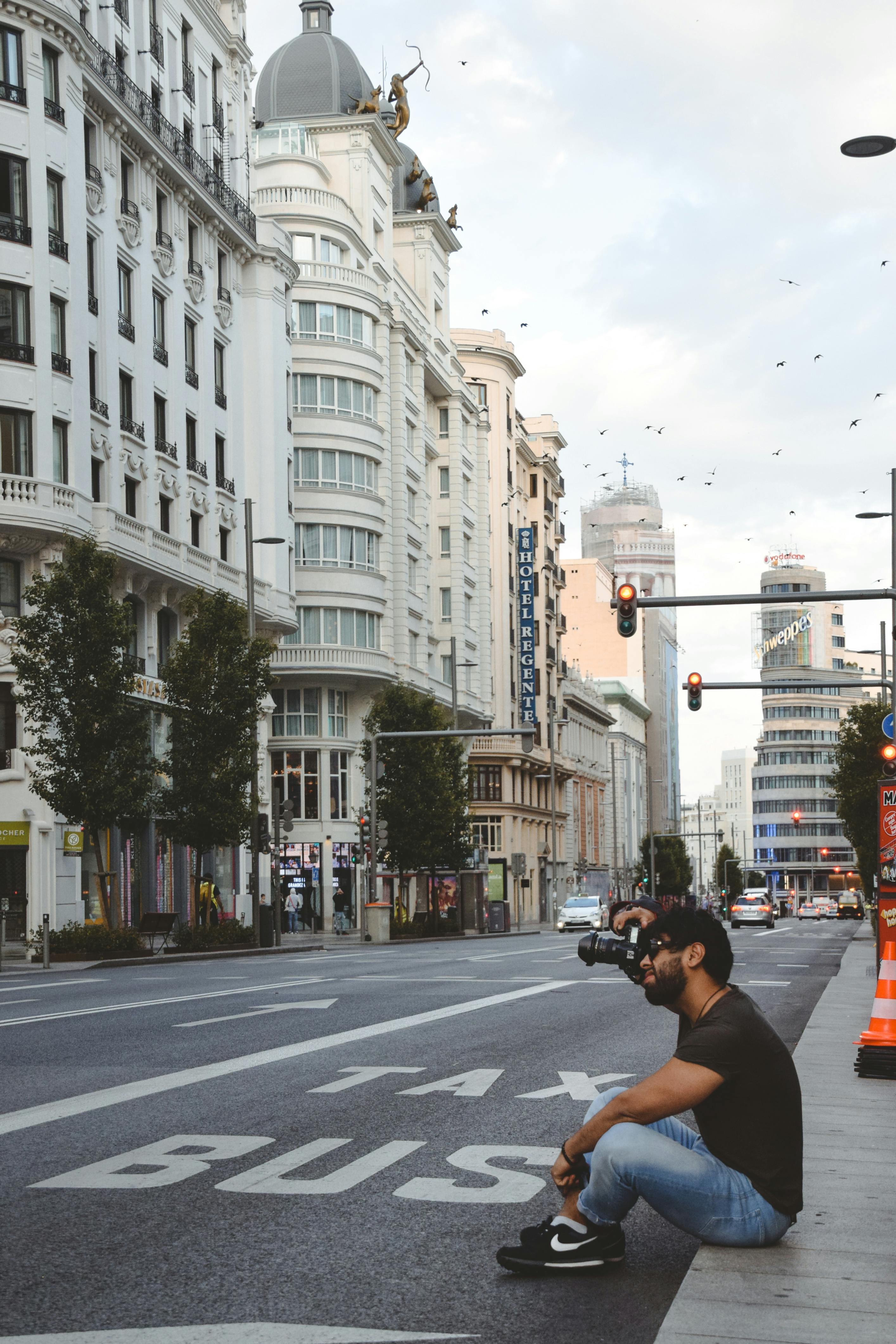 Urban Photographer in City Street Setting · Free Stock Photo