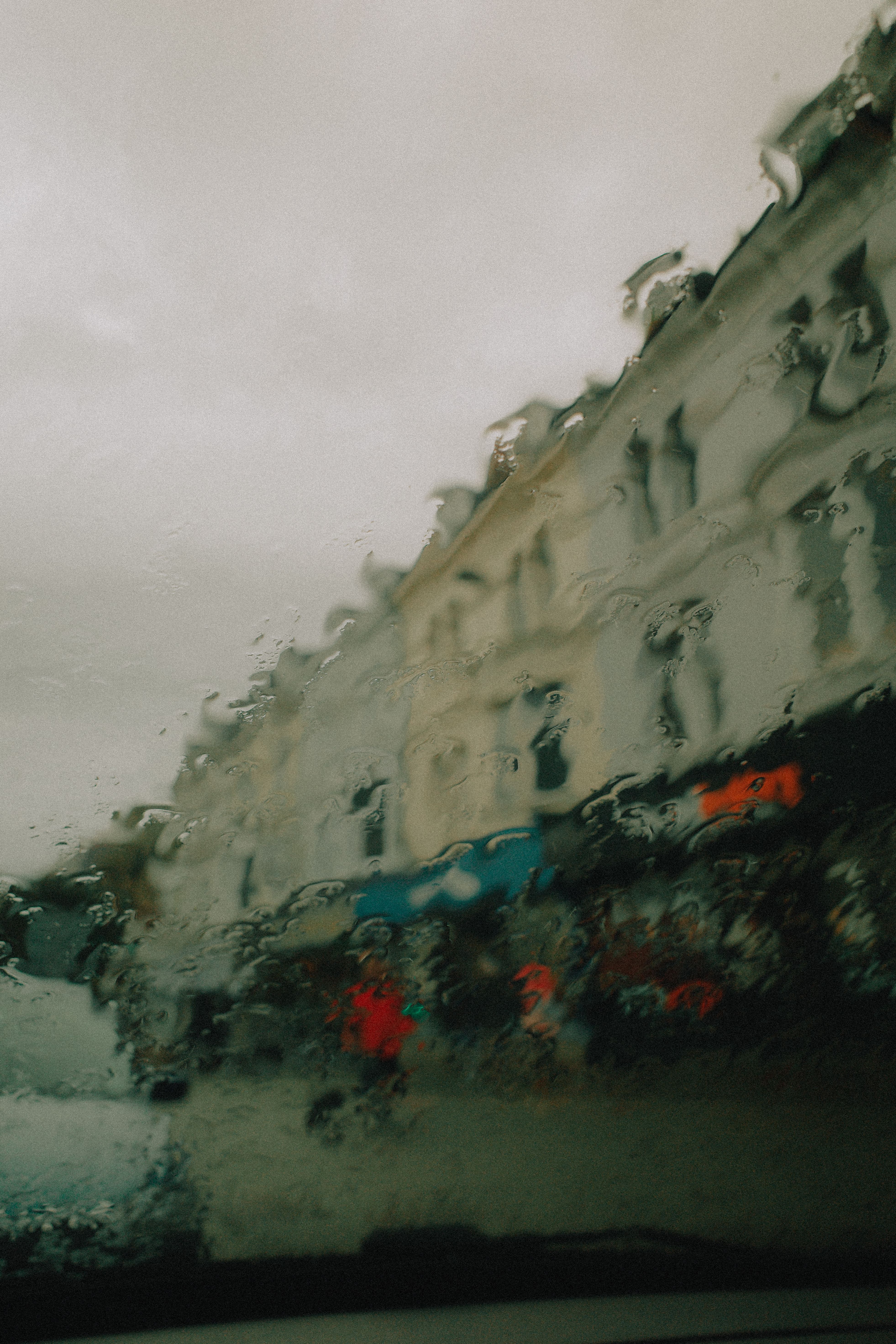 Blurry Rainy Day Cityscape Through Car Window · Free Stock Photo