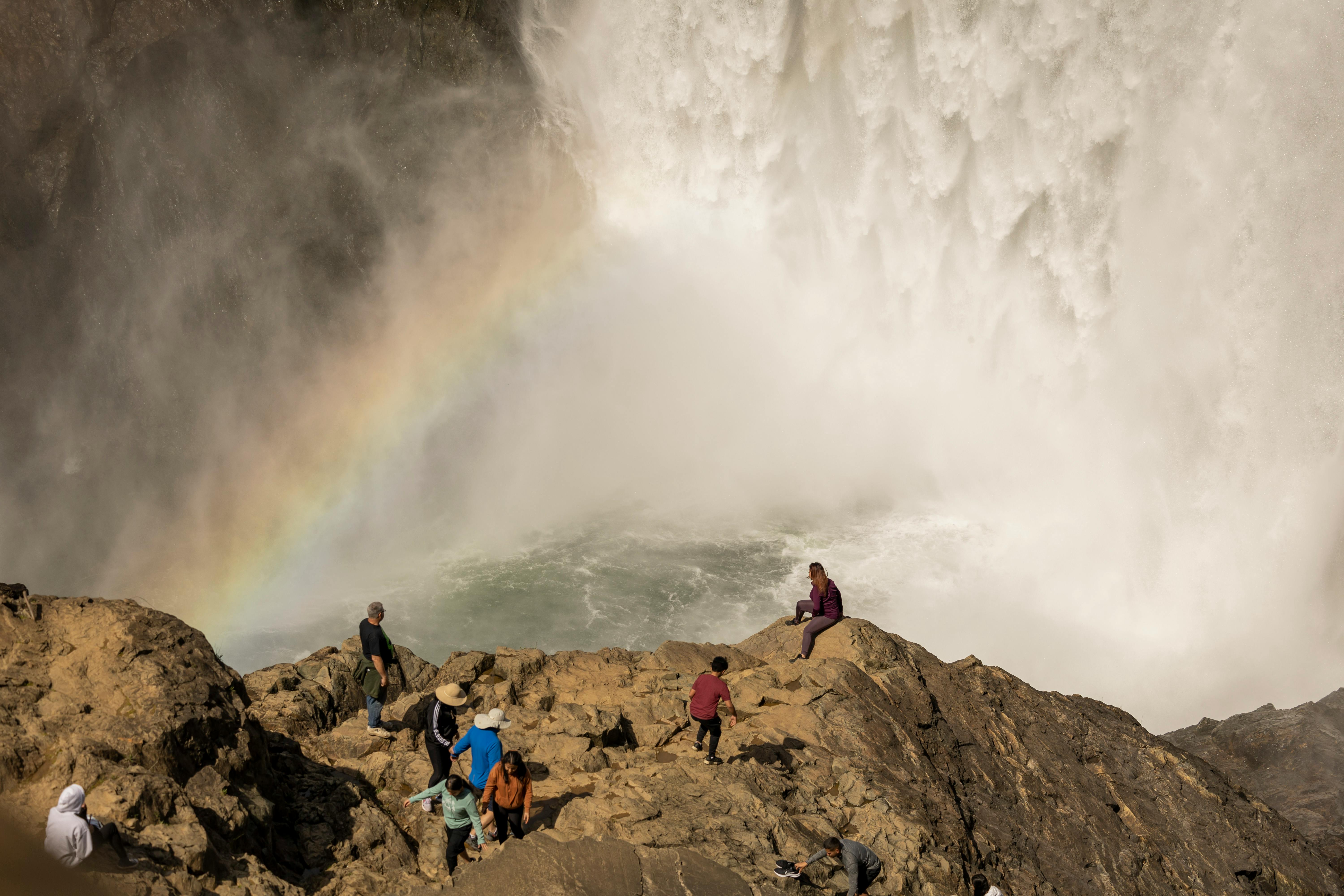 Dramatic Waterfall with Rainbow and Visitors · Free Stock Photo