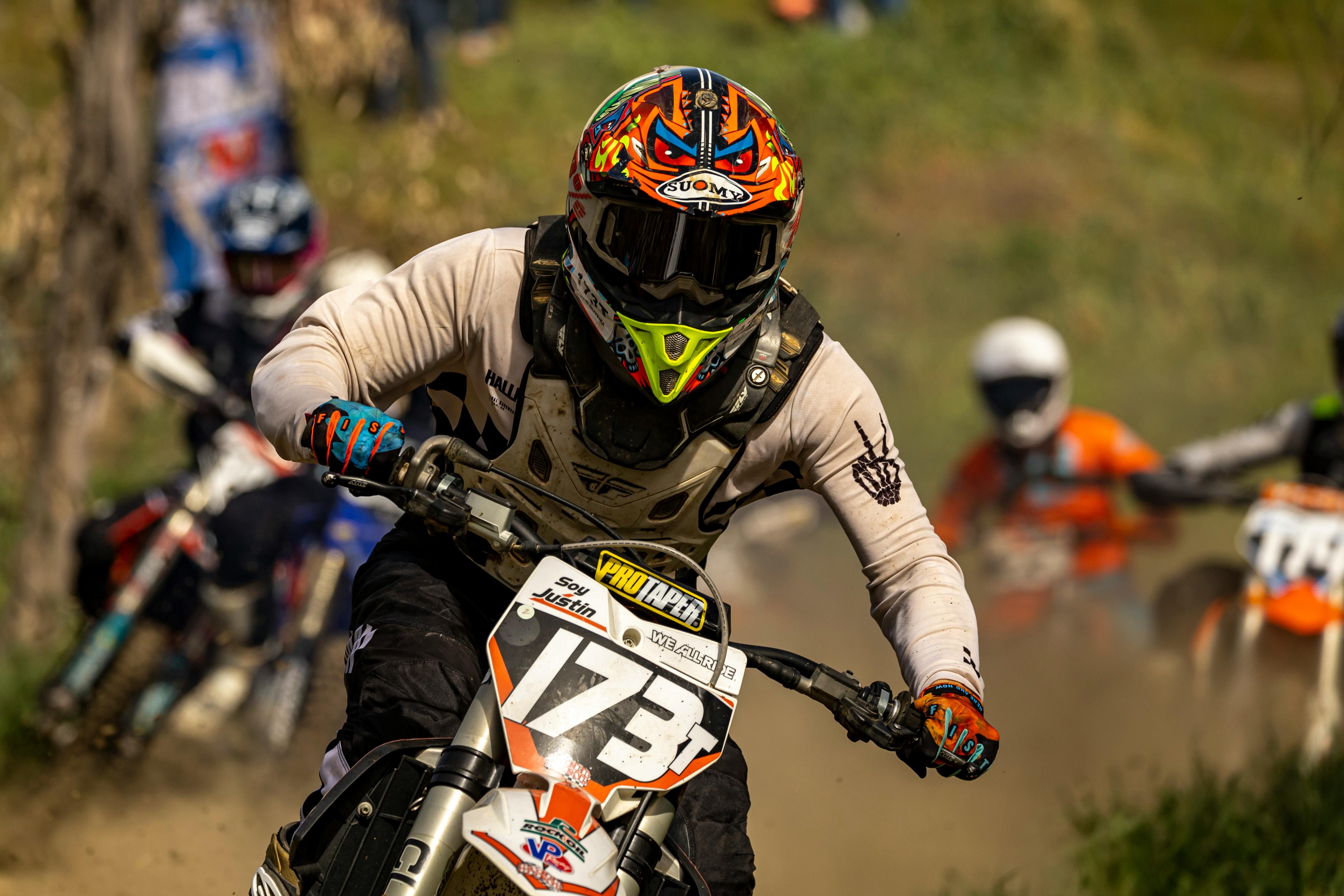 Intense Off-Road Motorcycle Racing Action · Free Stock Photo
