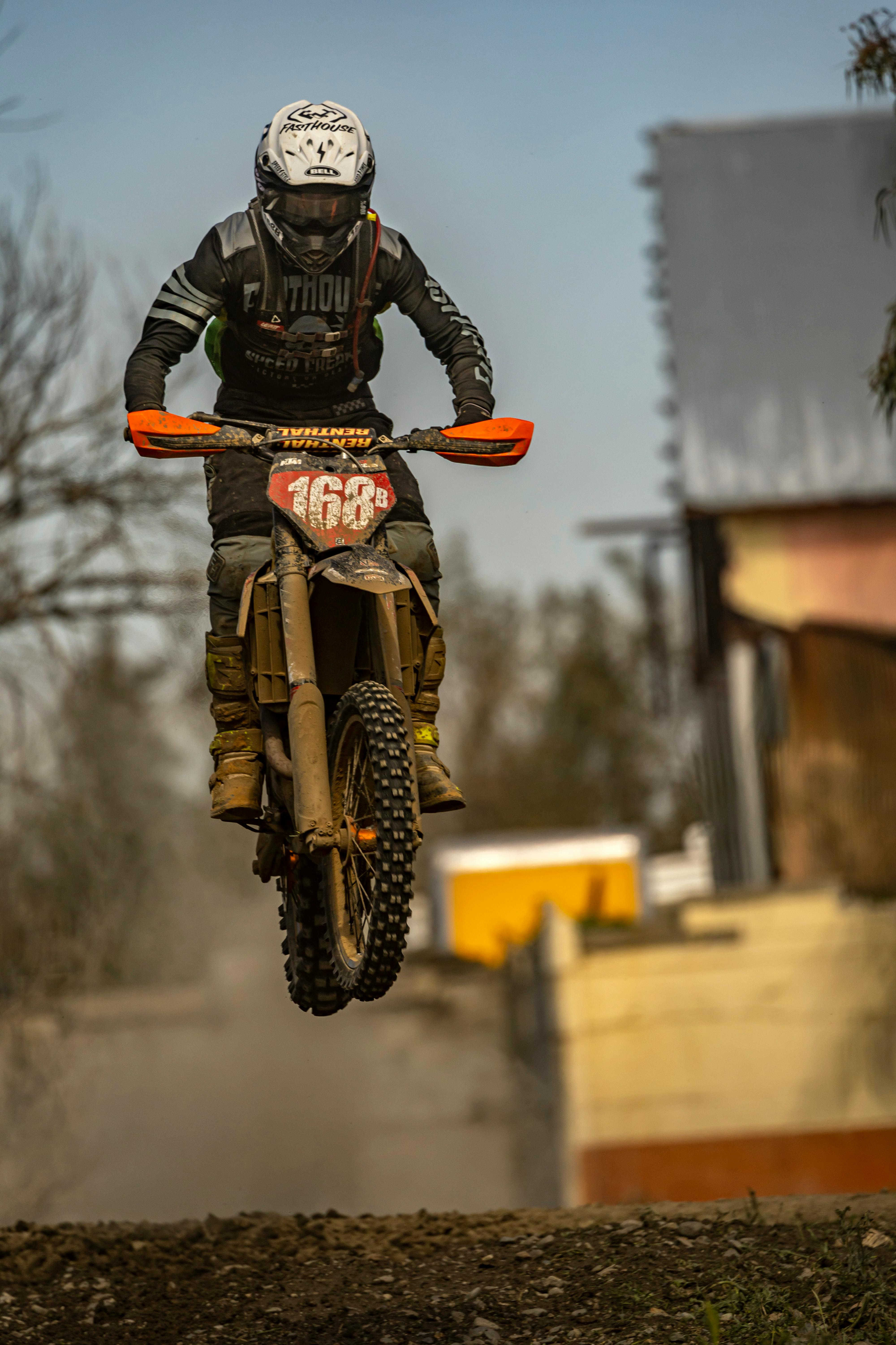 Intense Motorcycle Jump on Dirt Track · Free Stock Photo