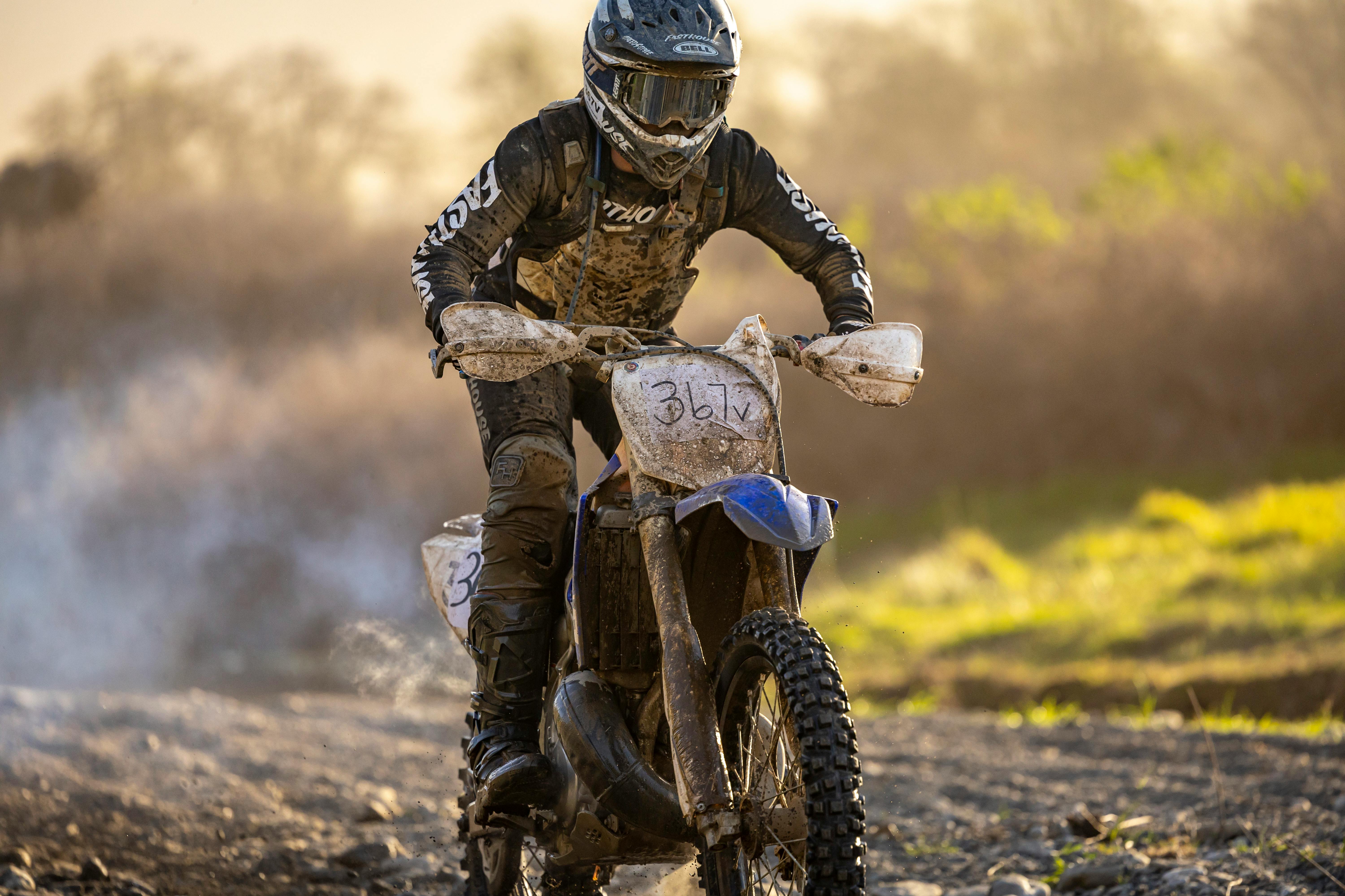Dynamic Dirt Biker Racing Through Muddy Trails · Free Stock Photo
