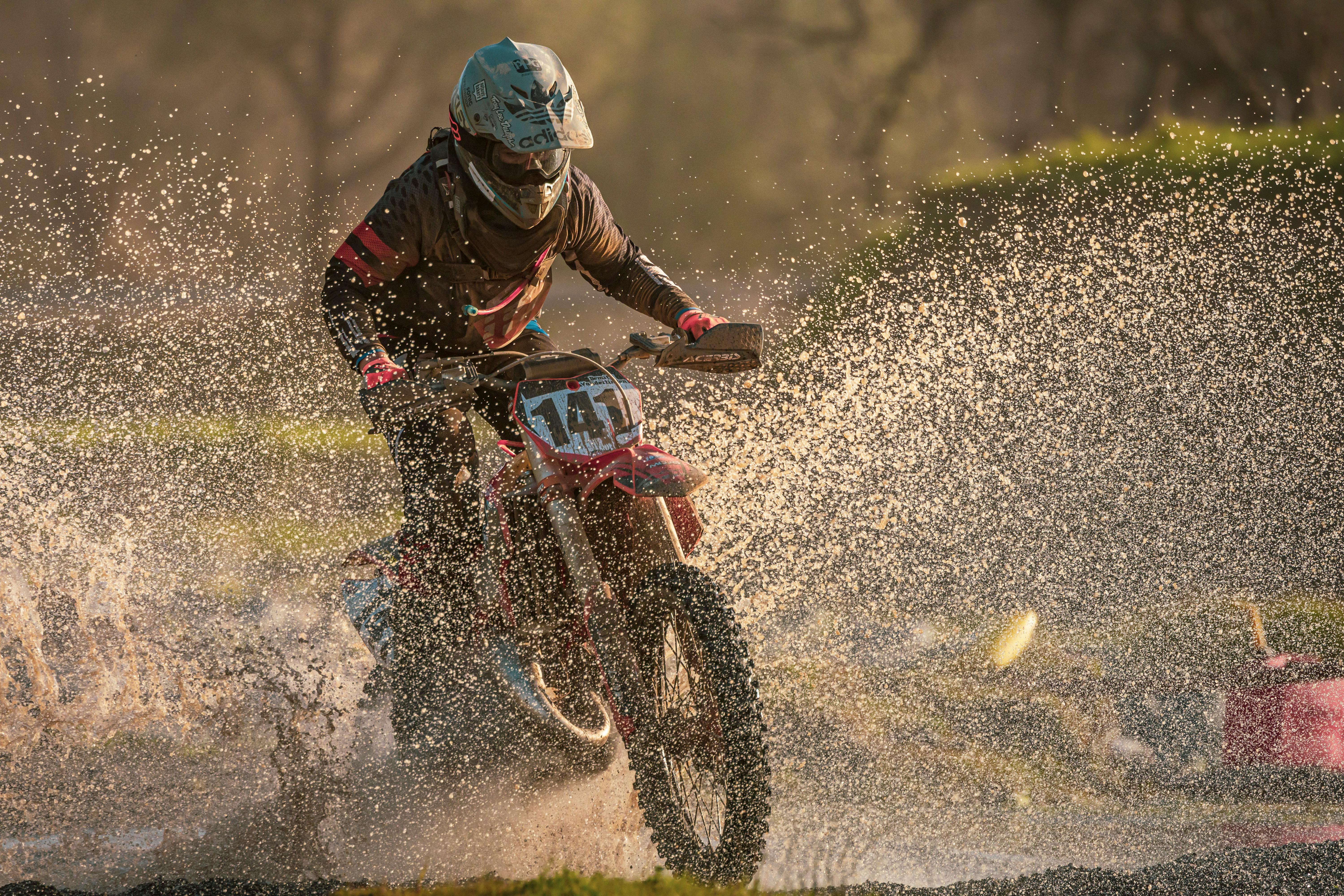 Dynamic Motocross Rider Water Splash Action · Free Stock Photo