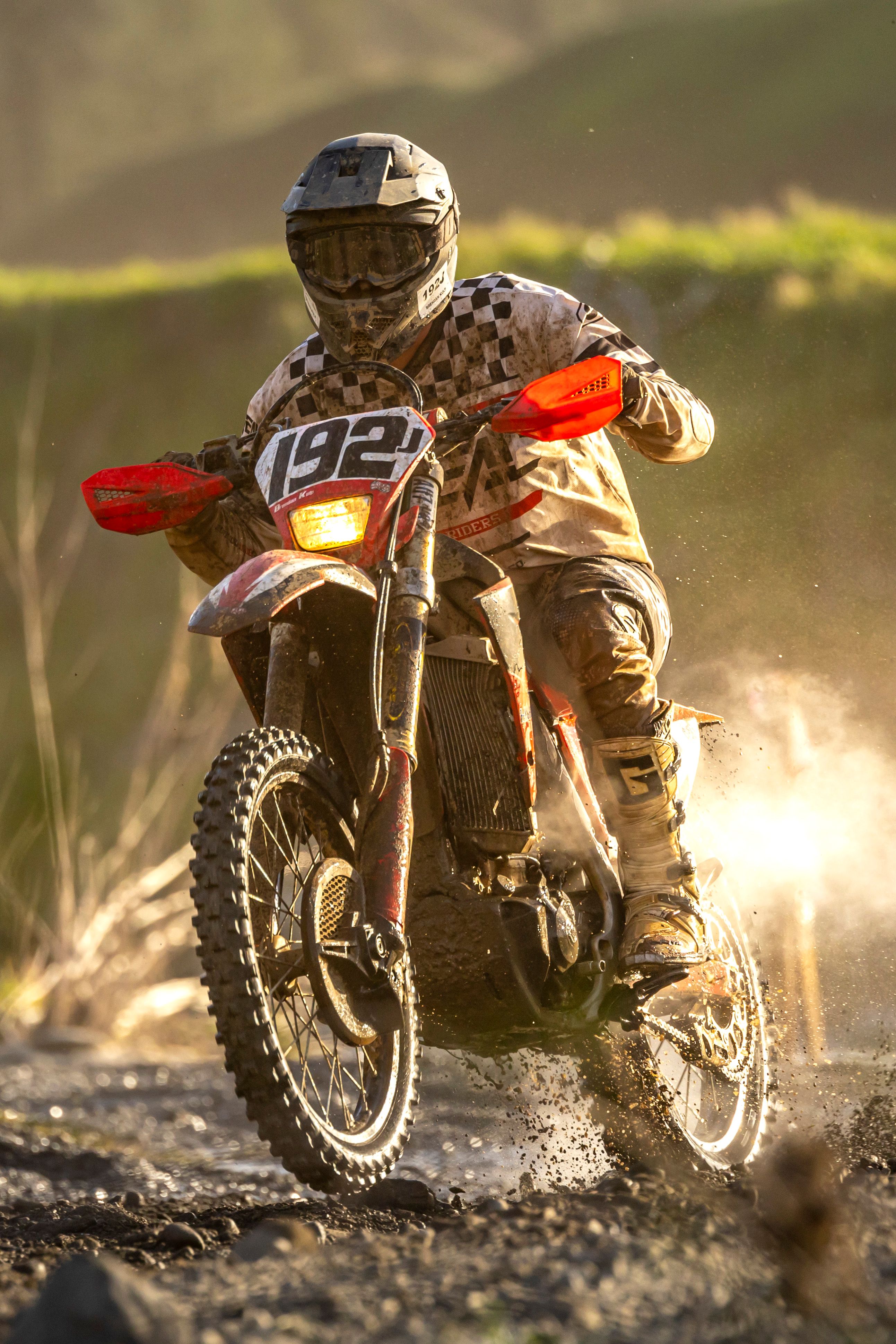 Dynamic Off-Road Motorcycle Racing Action Shot · Free Stock Photo